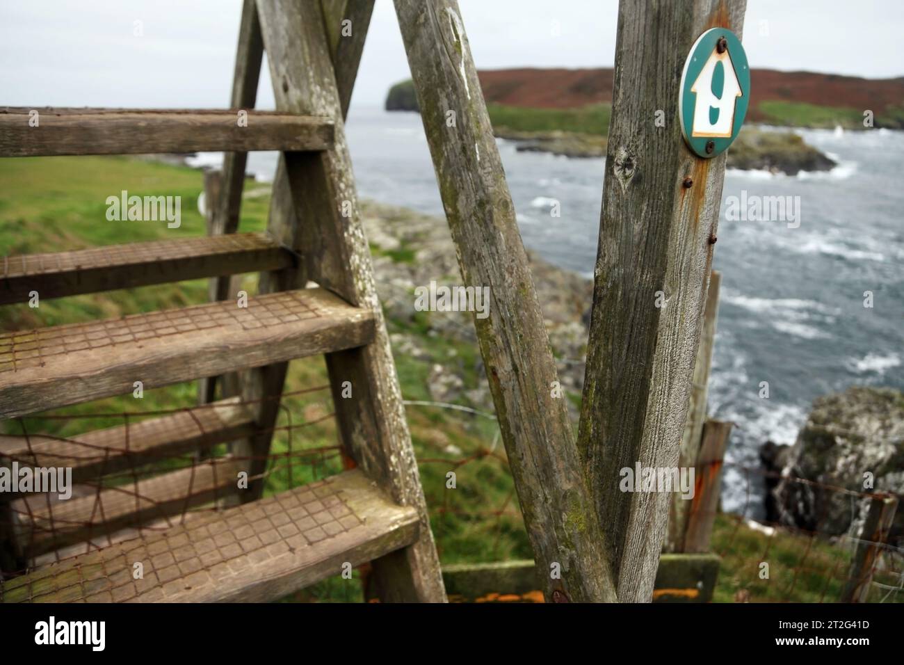 Wooden ladder stile for public footpath overlooking the Calf Sound and ...