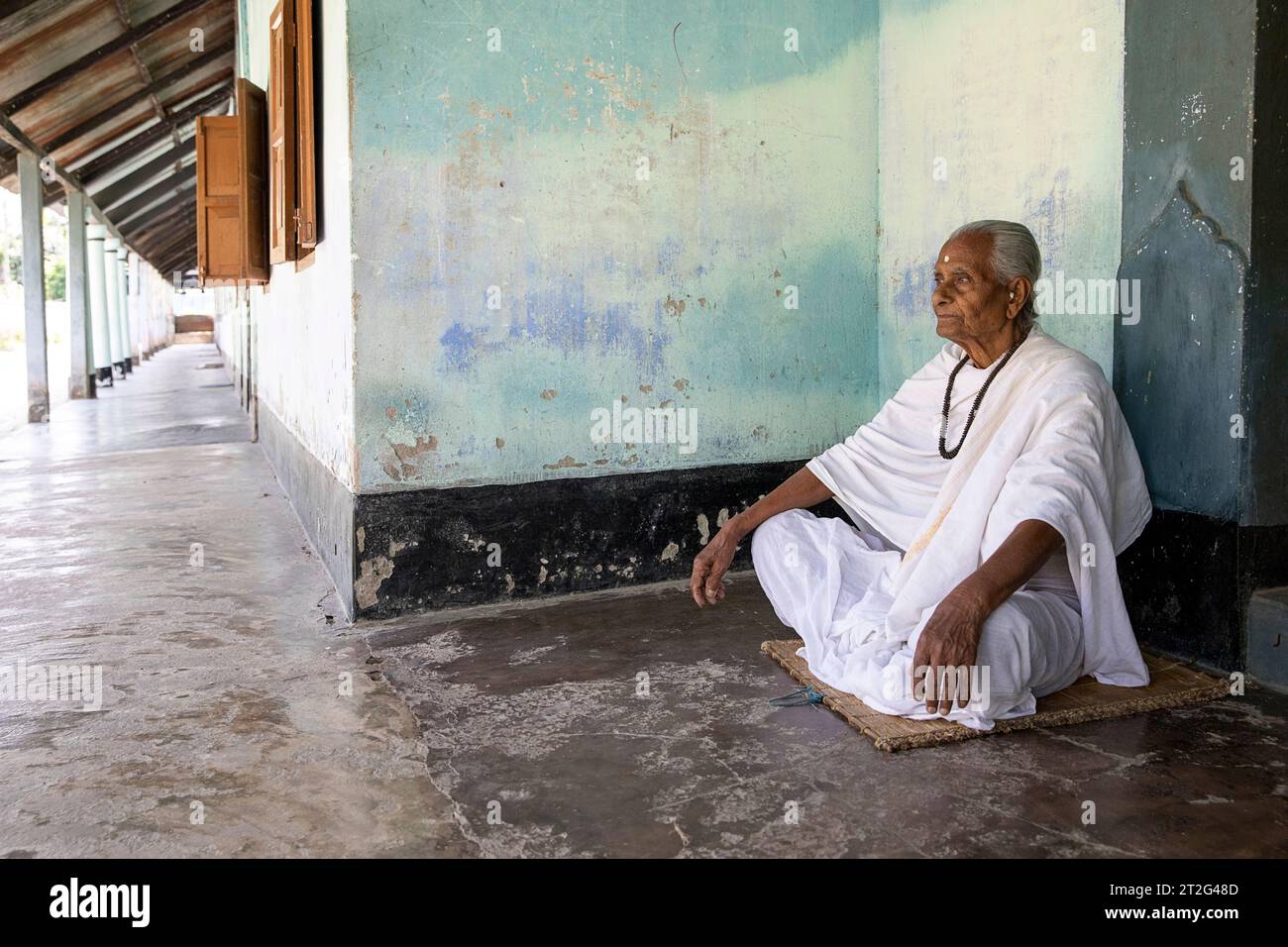 The oldest Hindu monk in traditional clothes sitting infront of the ...
