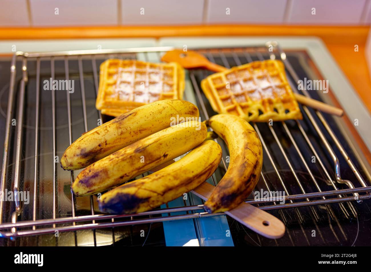 Ready-made waffles that lie on a grating to cool and bananas as an ...