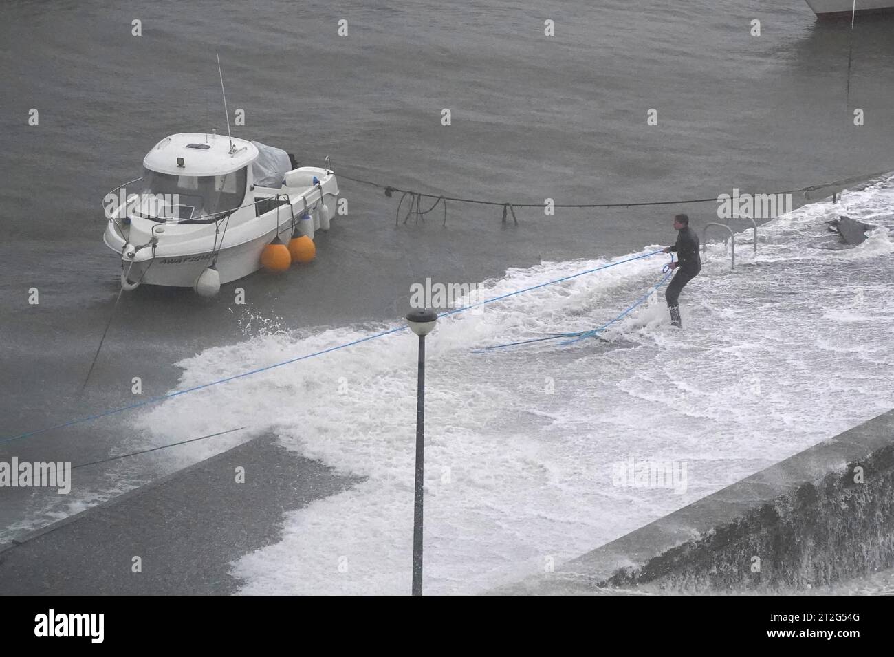 A man ties up his boat at Stonehaven Harbour. The UK is bracing for ...