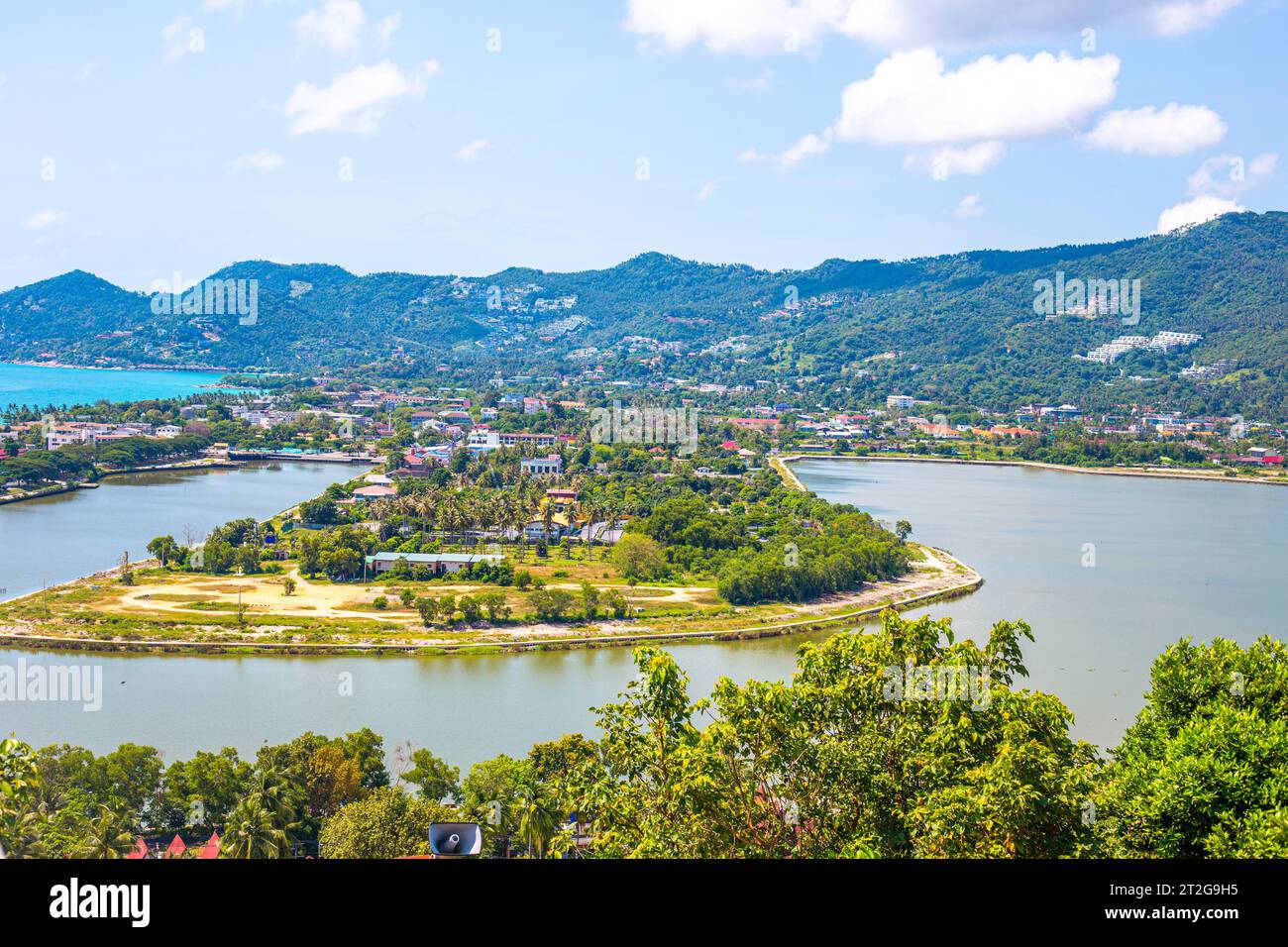 Lake with island and mountains. Tropical landscape Stock Photo - Alamy