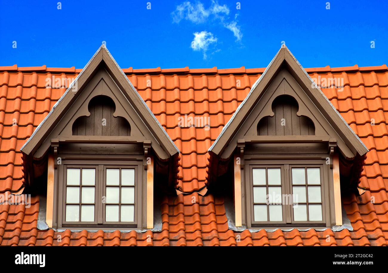 a red Roof with brown Windows Stock Photo - Alamy