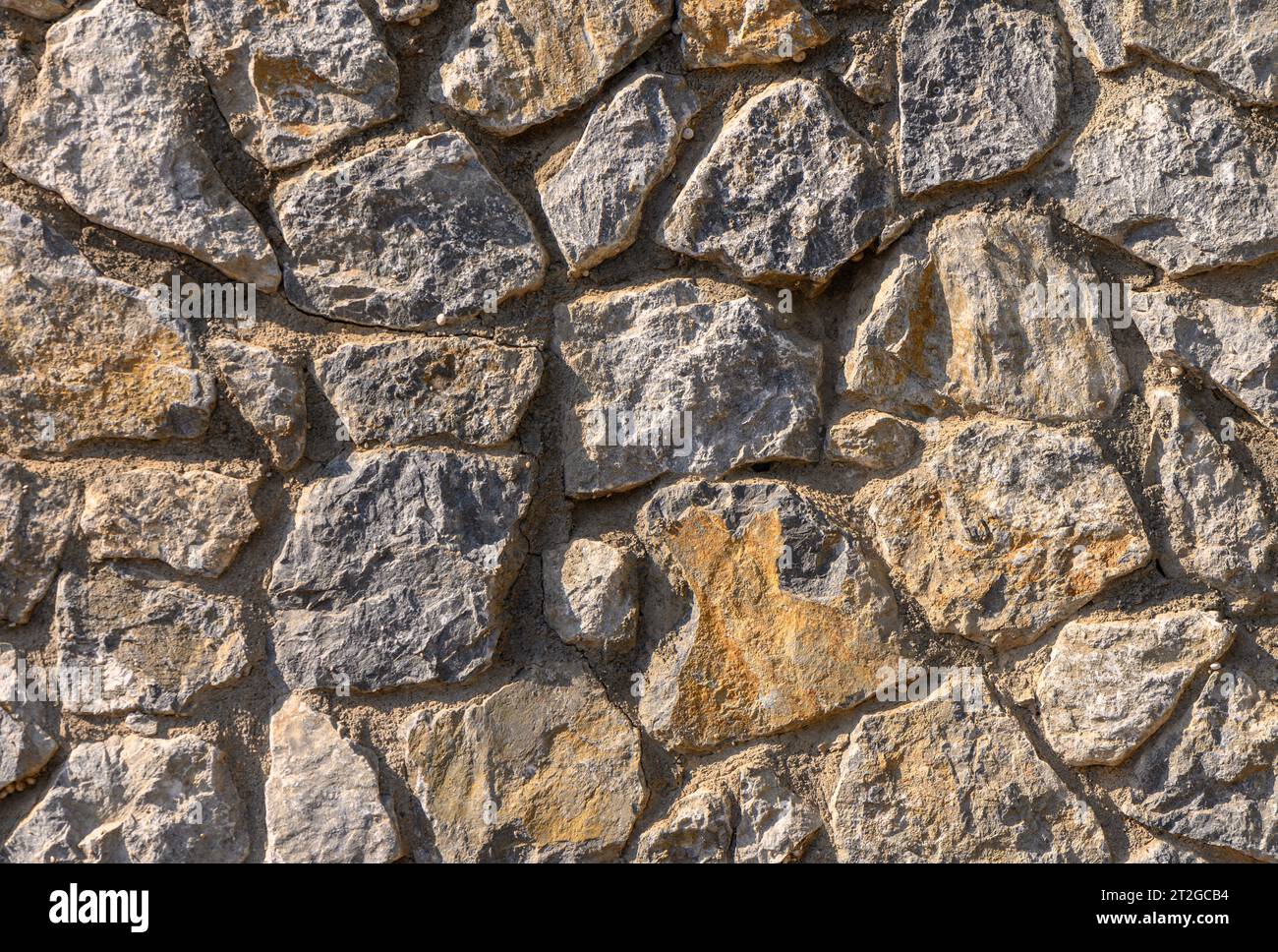 old stone fence as background 4 Stock Photo - Alamy