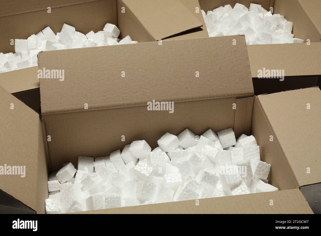 Many open cardboard boxes with pieces of polystyrene foam Stock Photo ...