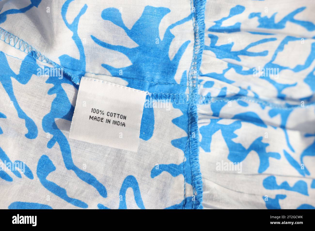 Clothing label on color garment, closeup view Stock Photo - Alamy