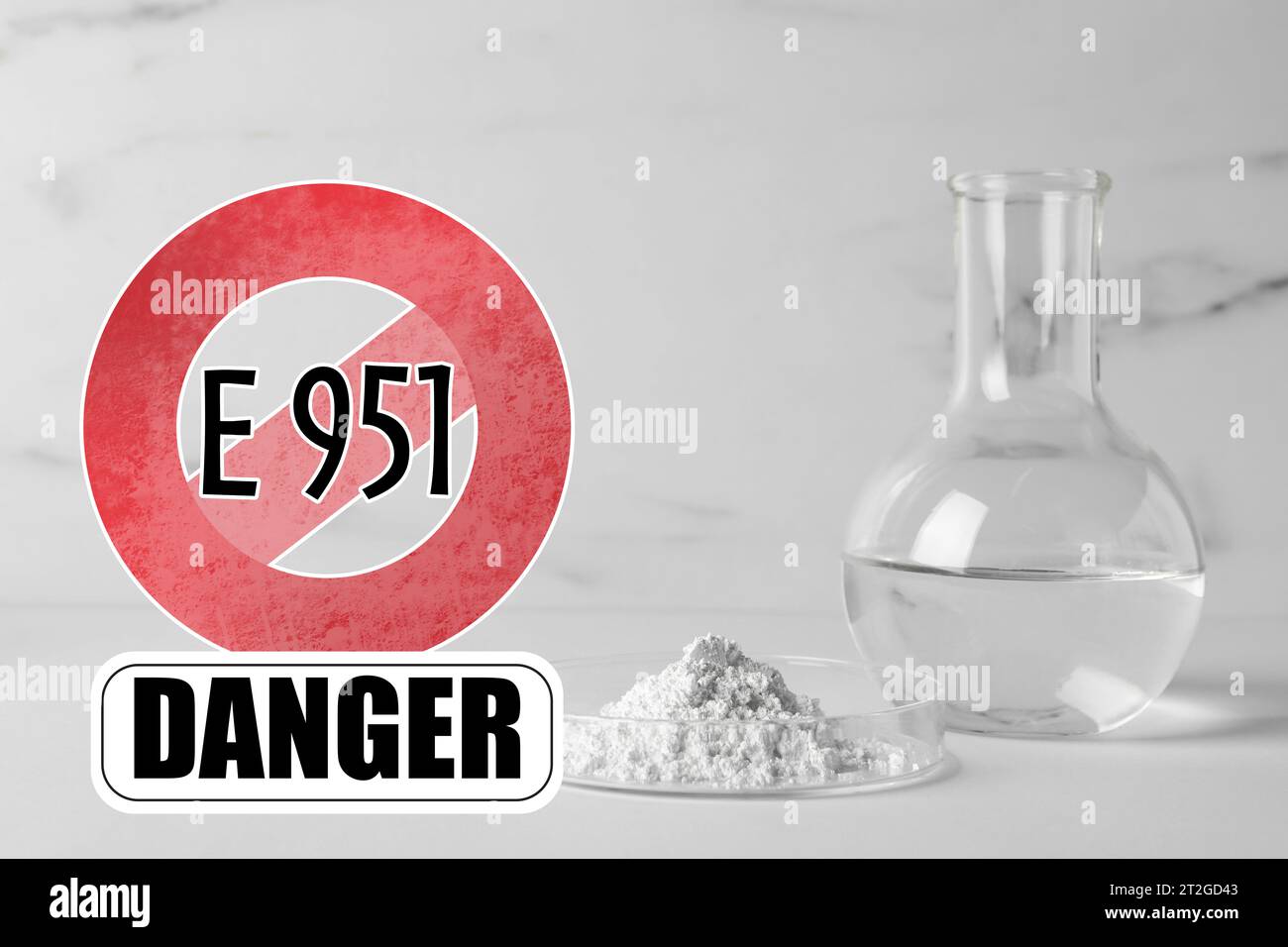 Hazard of aspartame. Prohibition sign with code (E951) and artificial ...