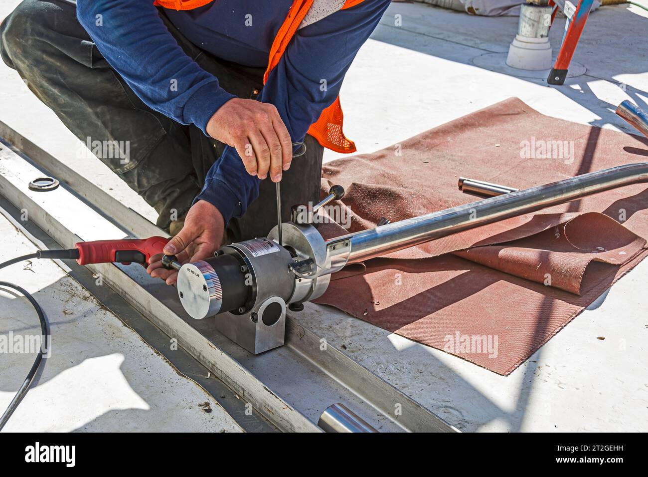 A tube facing and squaring tool is used on stainless steel tubing used ...