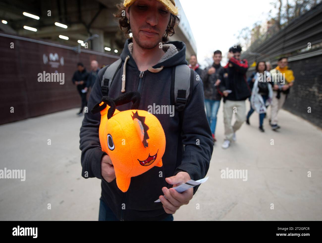 Buenos Aires, Argentina. 18th Oct, 2023. A young voter shows his mascot ...