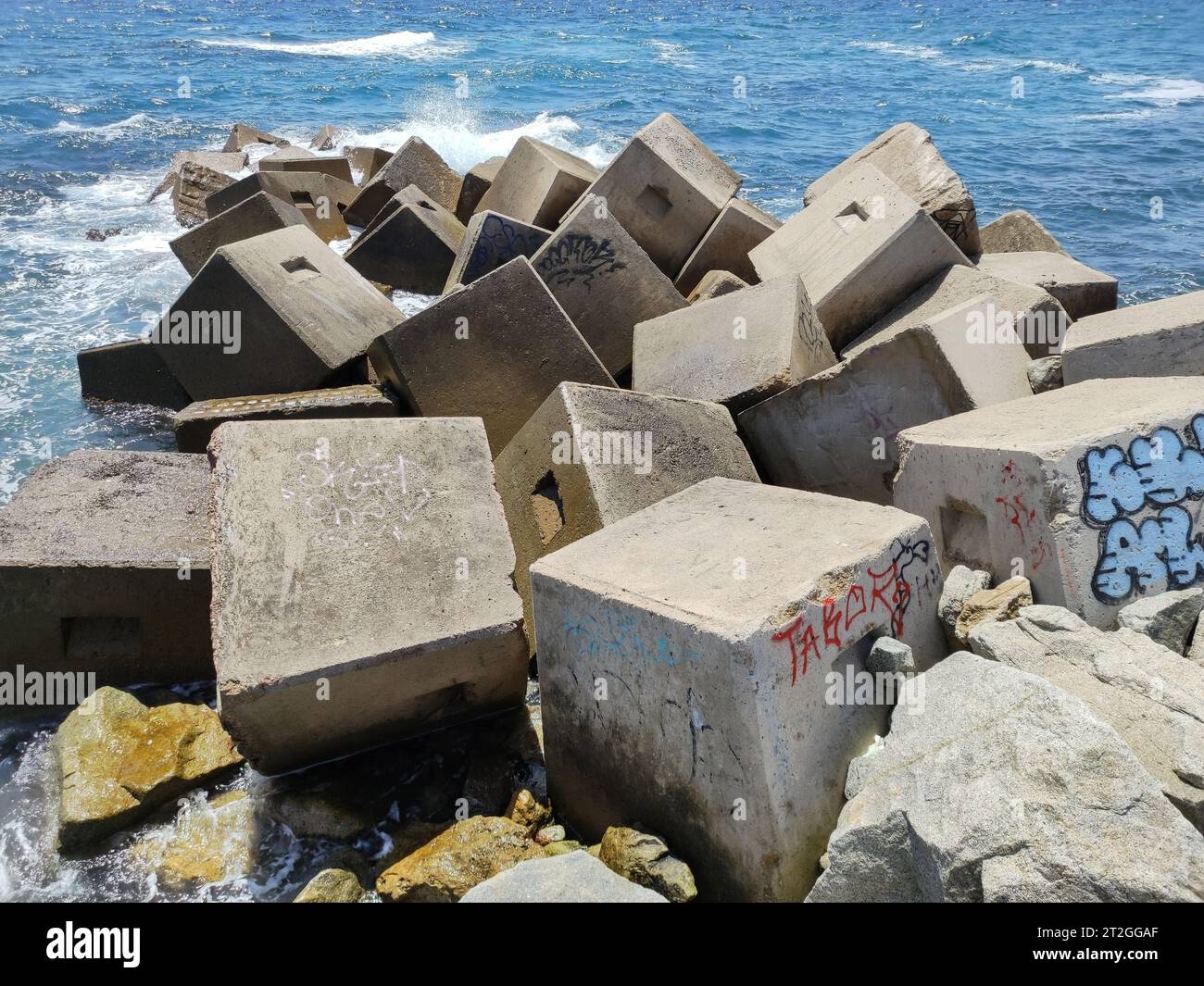 Detail of the breakwater stones of the breakwater on the beach of ...