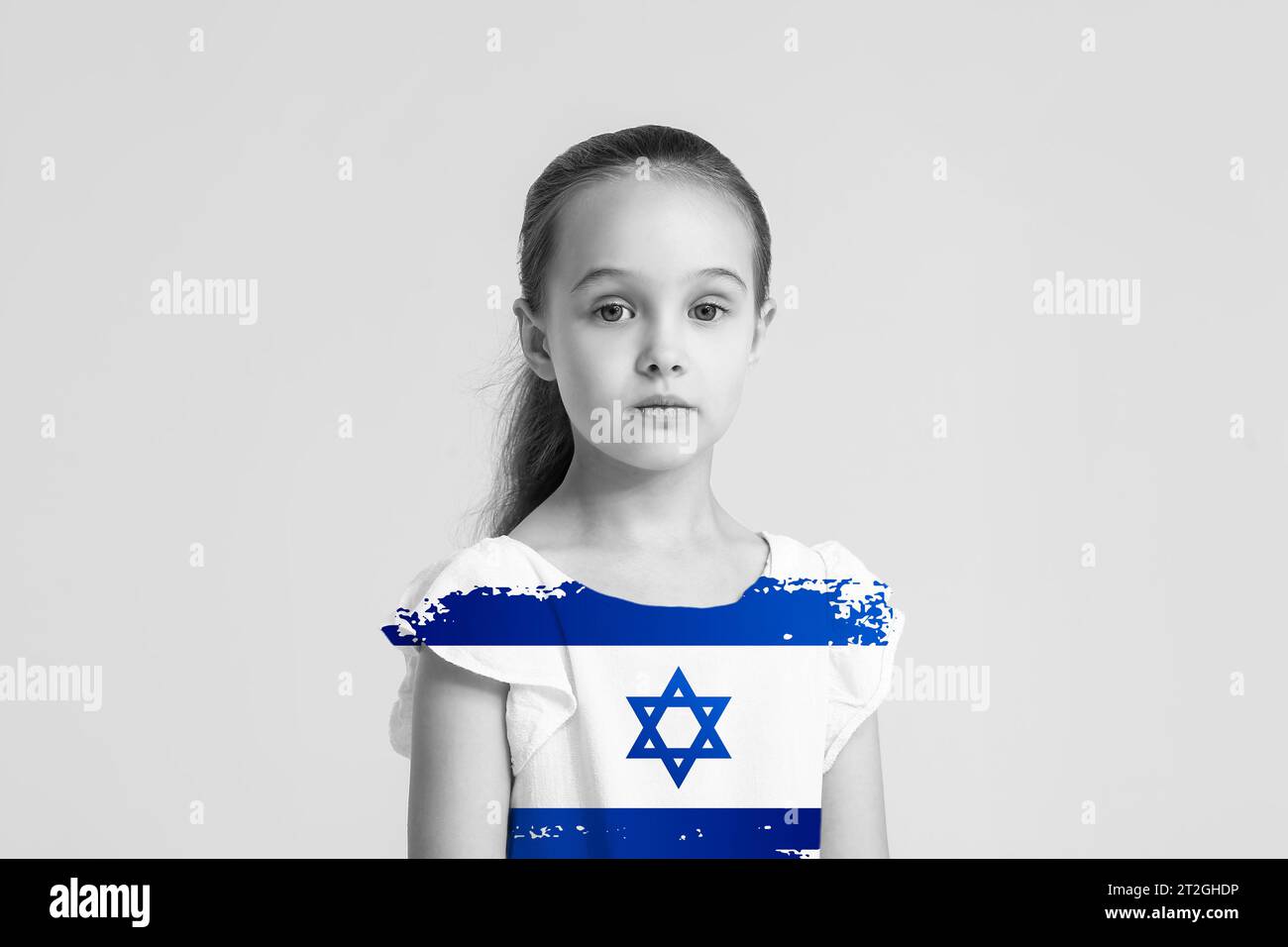 Cute little girl in clothes with print of Israeli flag on light ...