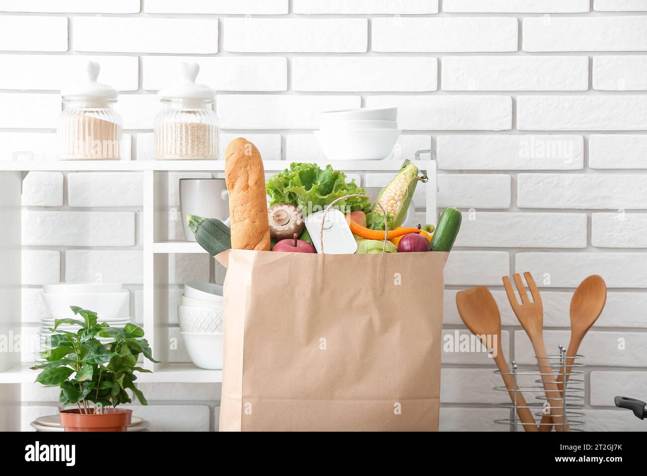 Paper bag with different products and utensils in kitchen Stock Photo ...