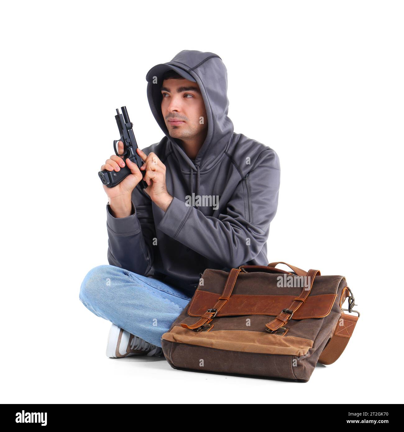 Male student with gun on white background. School shooting concept ...