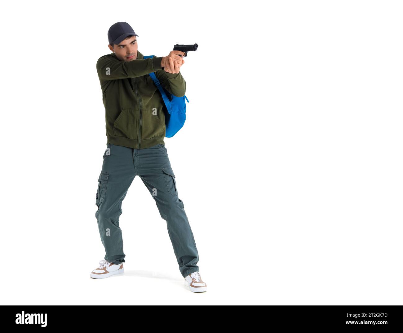 Male student with gun on white background. School shooting concept ...