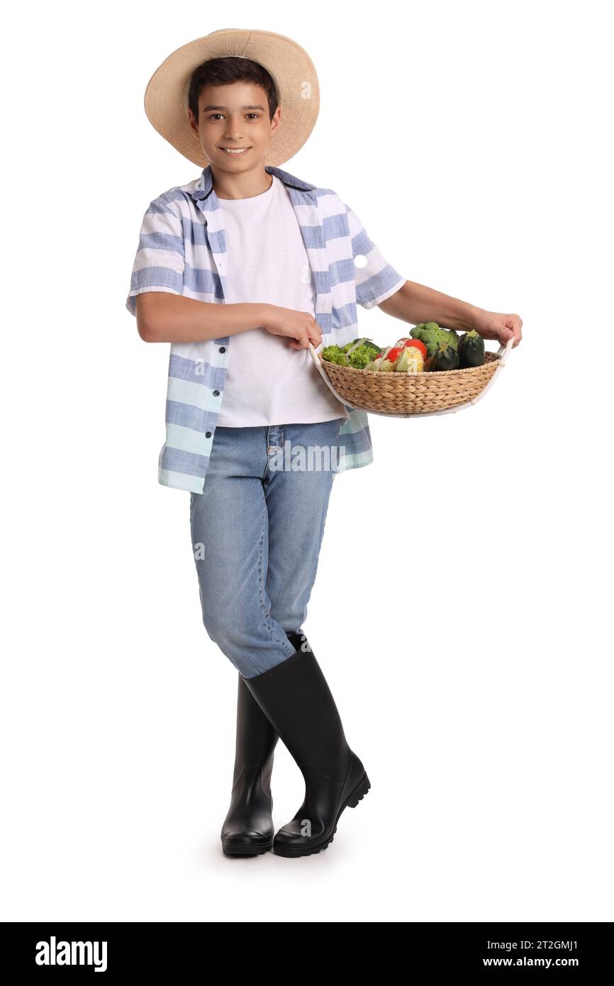 Little farmer with fresh food on white background Stock Photo - Alamy