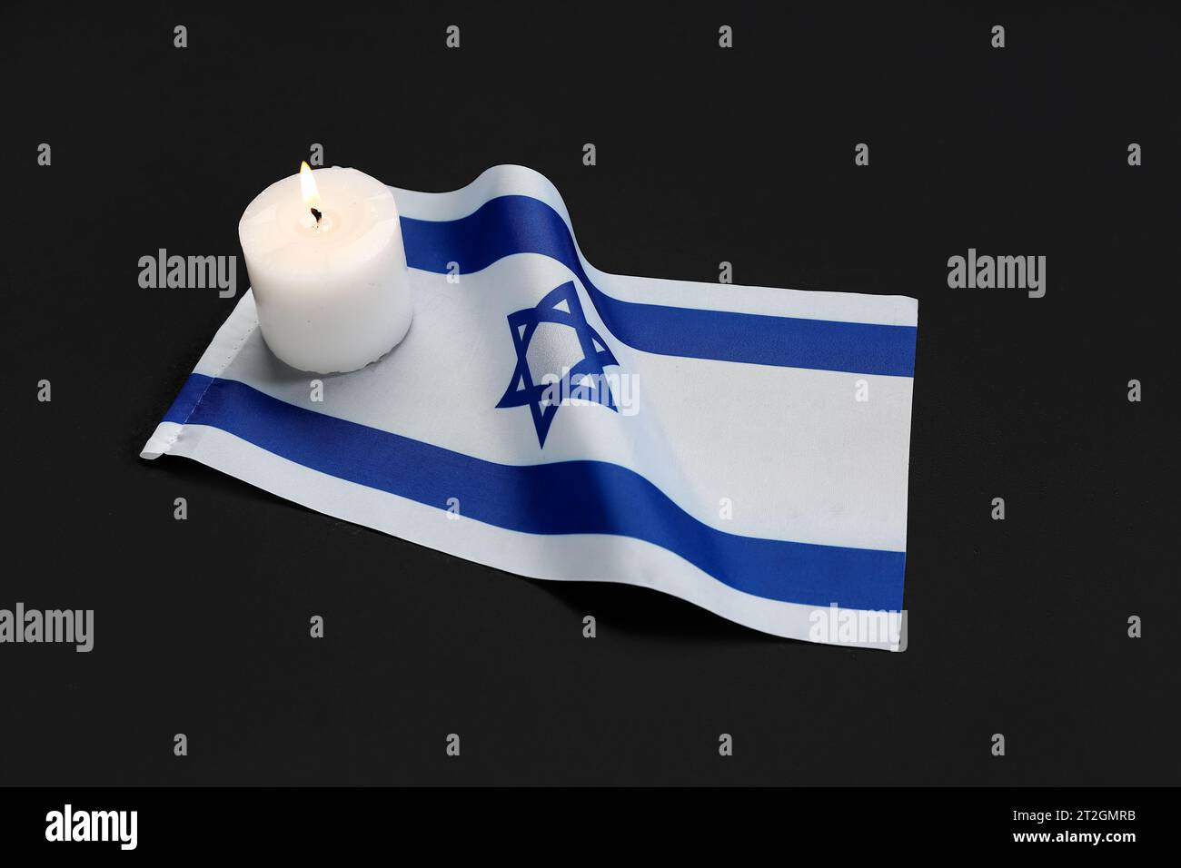 Flag of Israel with burning candle on dark background Stock Photo - Alamy