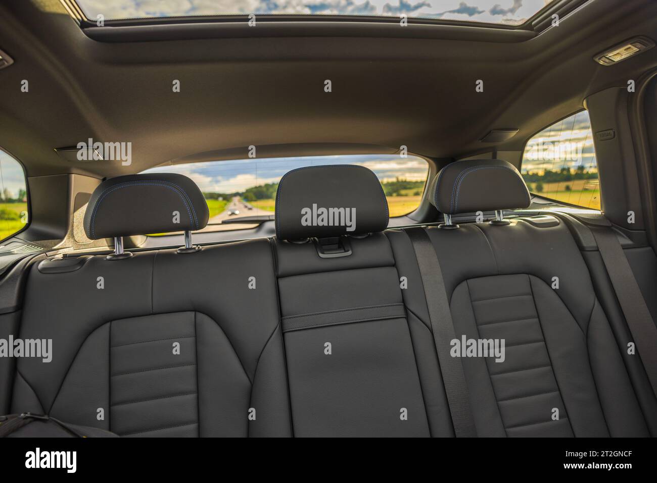 Beautiful rear view interior with leather seats and panoramic sunroof ...