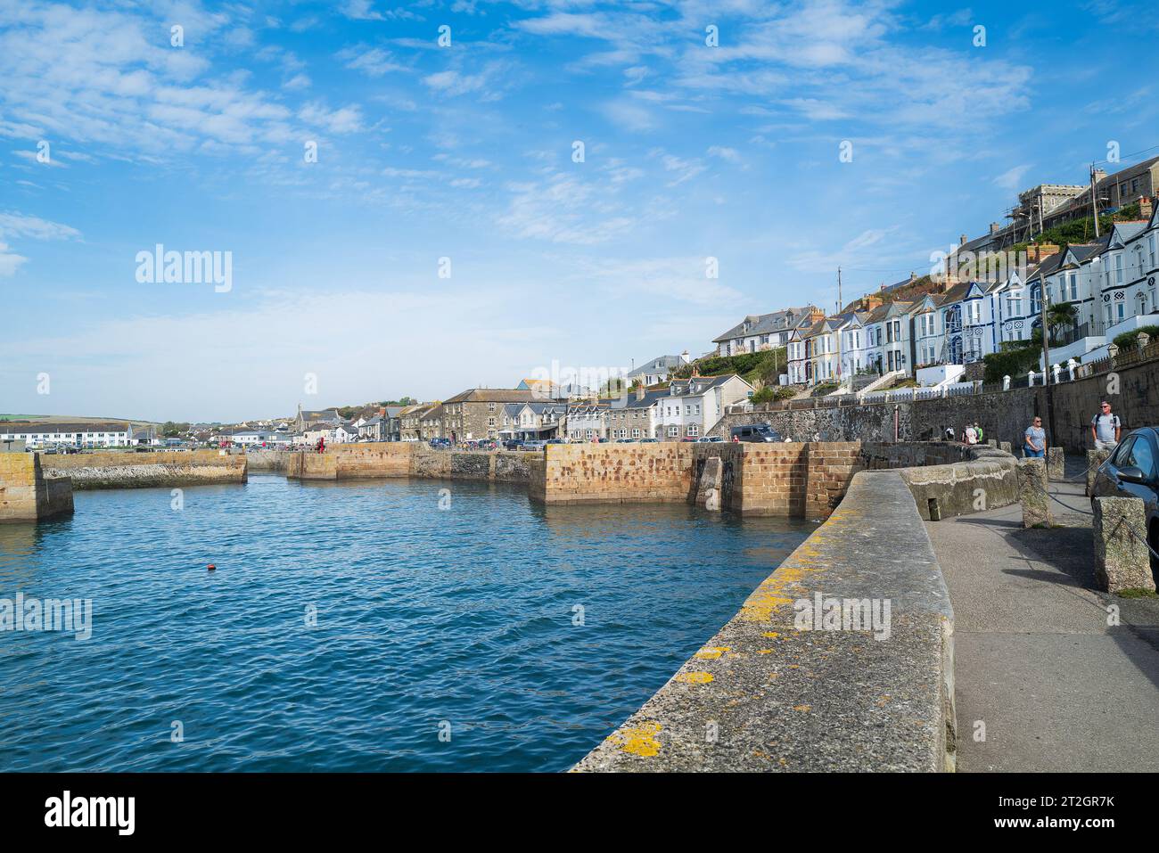 Porthleven, UK - Oct 9 2023 The harbour area and promenade wall on a ...