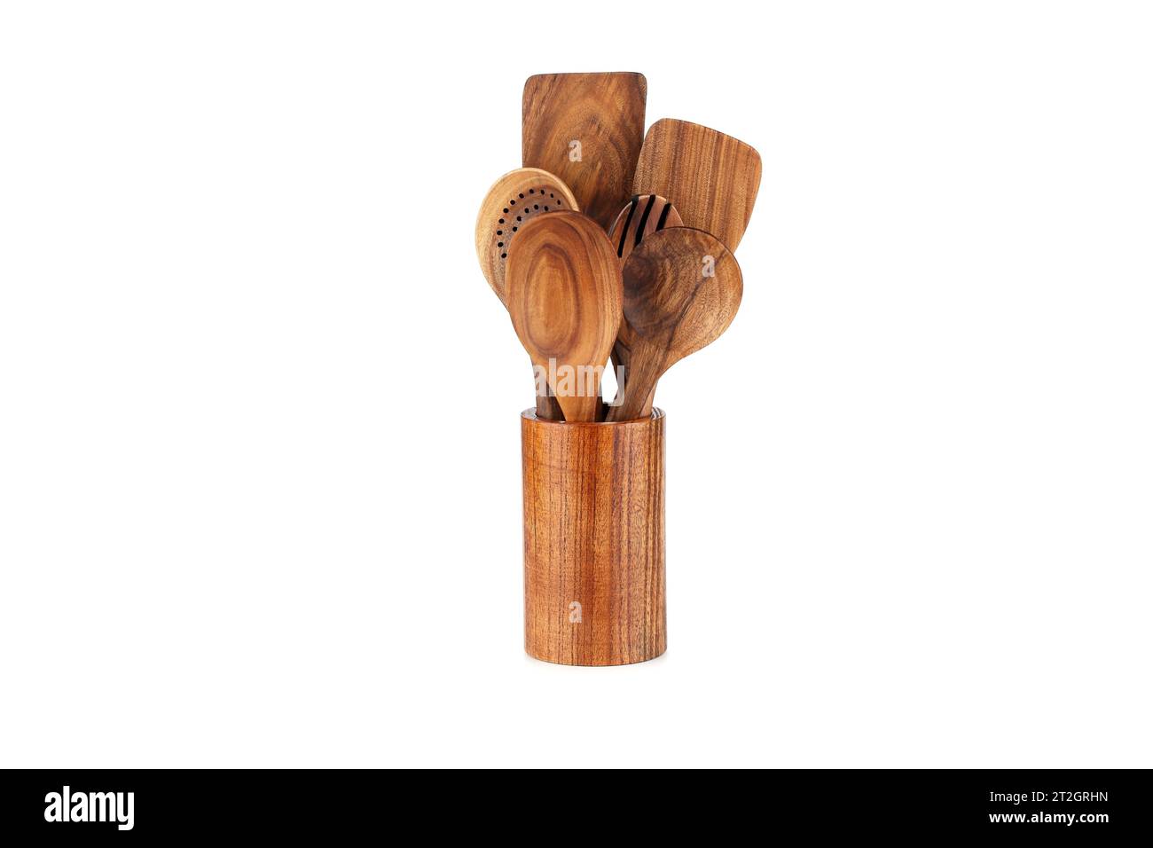 Set of wooden kitchen utensils in container isolated on white ...