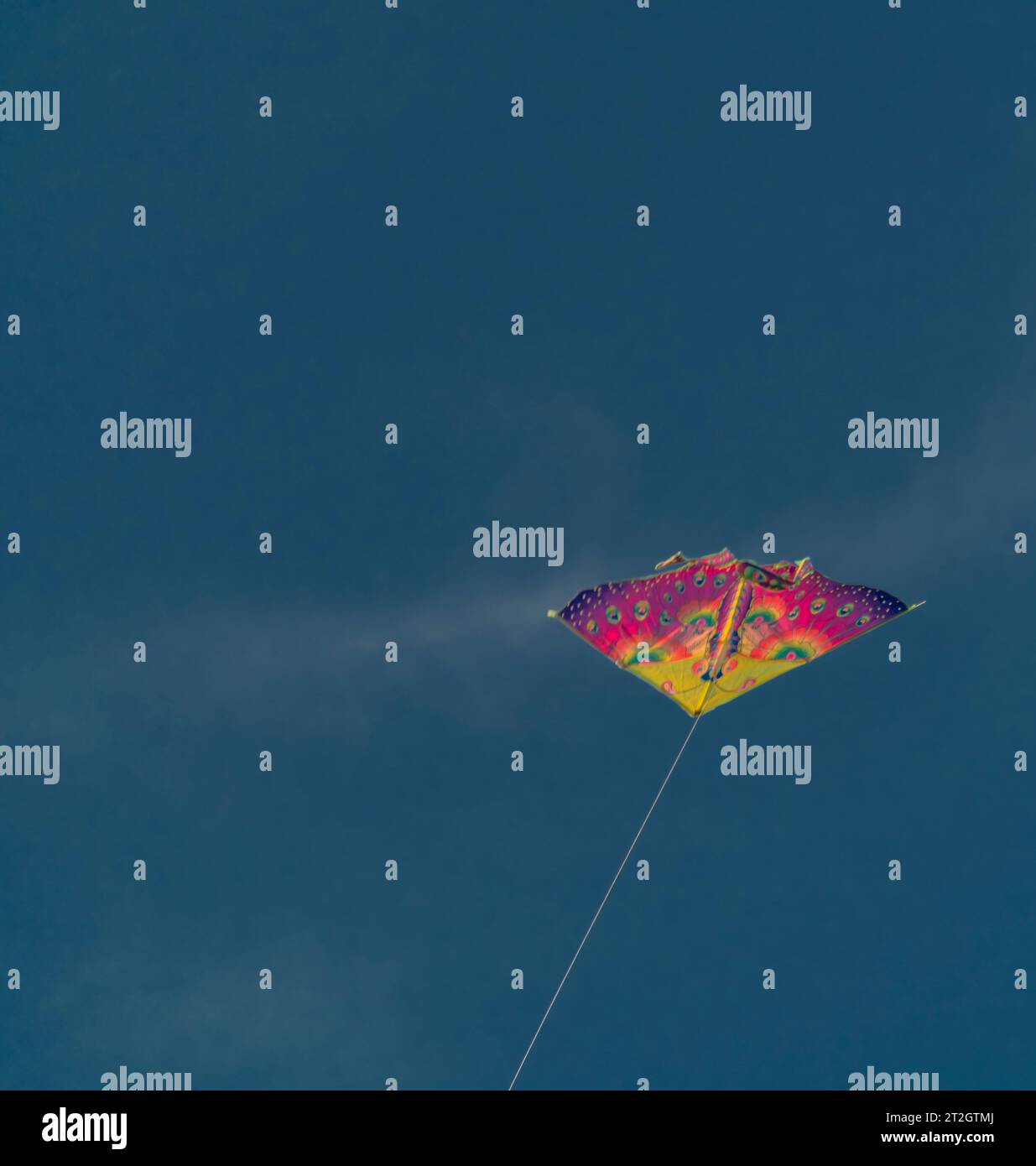 Color kite with blue sky and white clouds in sunny nice autumn windy ...