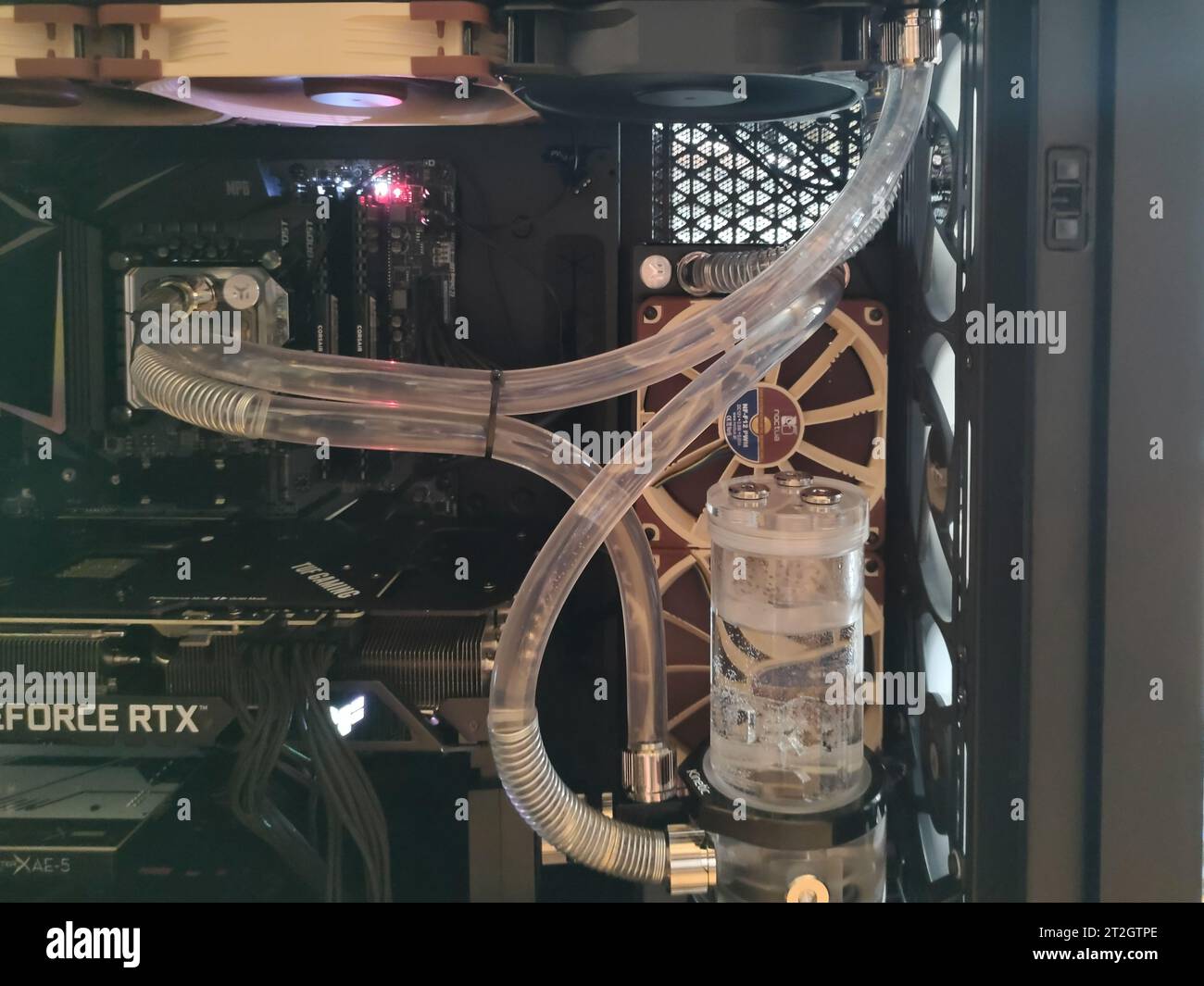 Detail of the water tank with pump for the computer cooling circuit ...