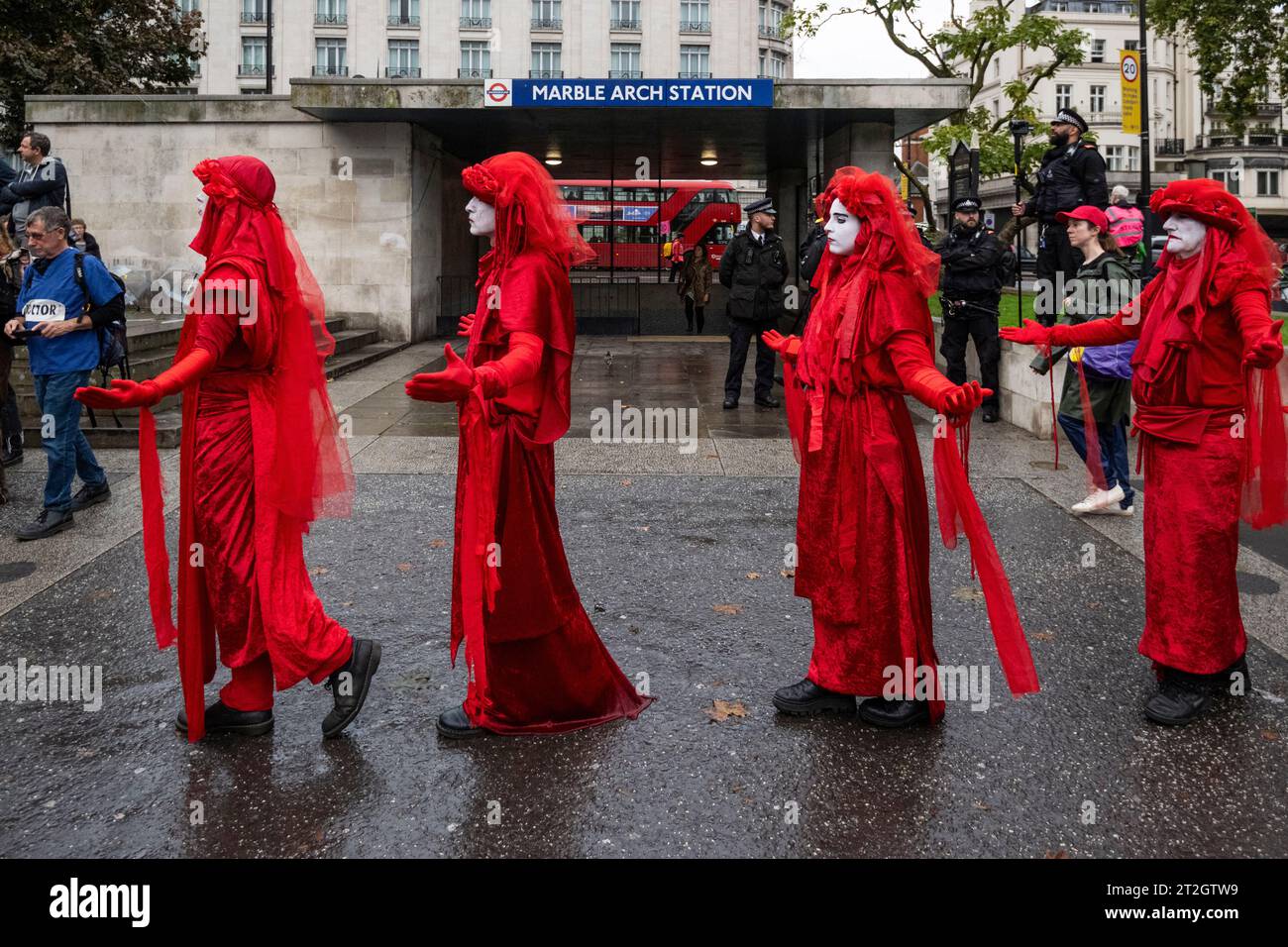 London, UK. 19 October 2023. Red Rebels join activists from Fossil Free ...
