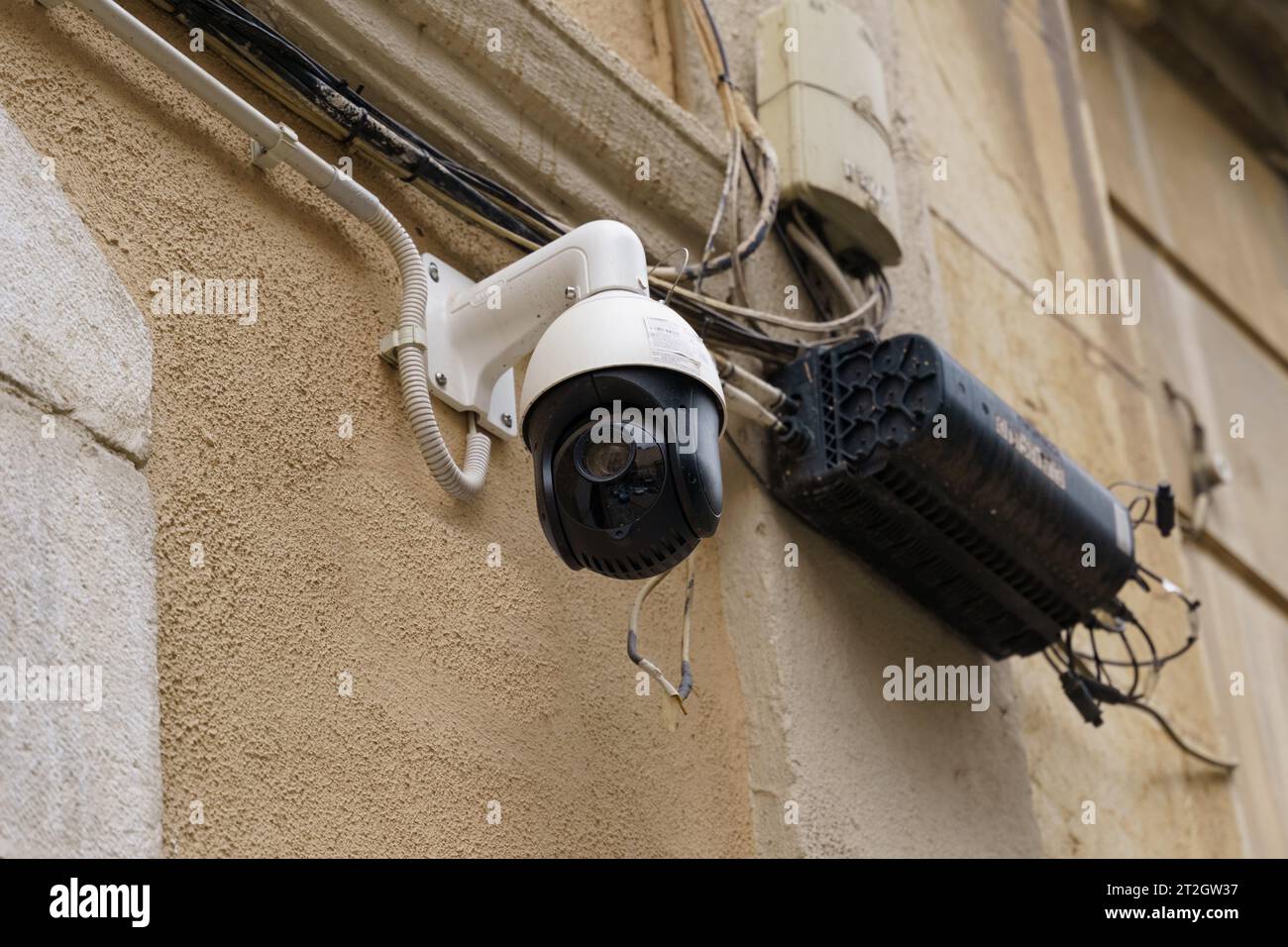A CCTV camera is attached to the facade of the house for surveillance ...