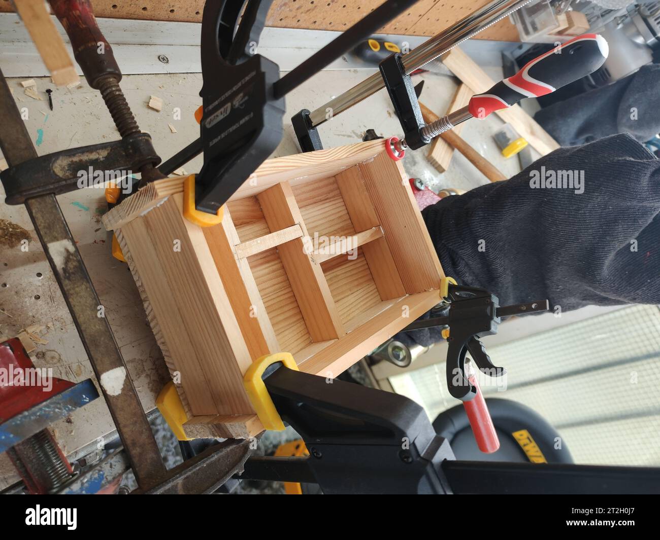 Detail of the process of gluing the wood in the manufacture of a wooden ...