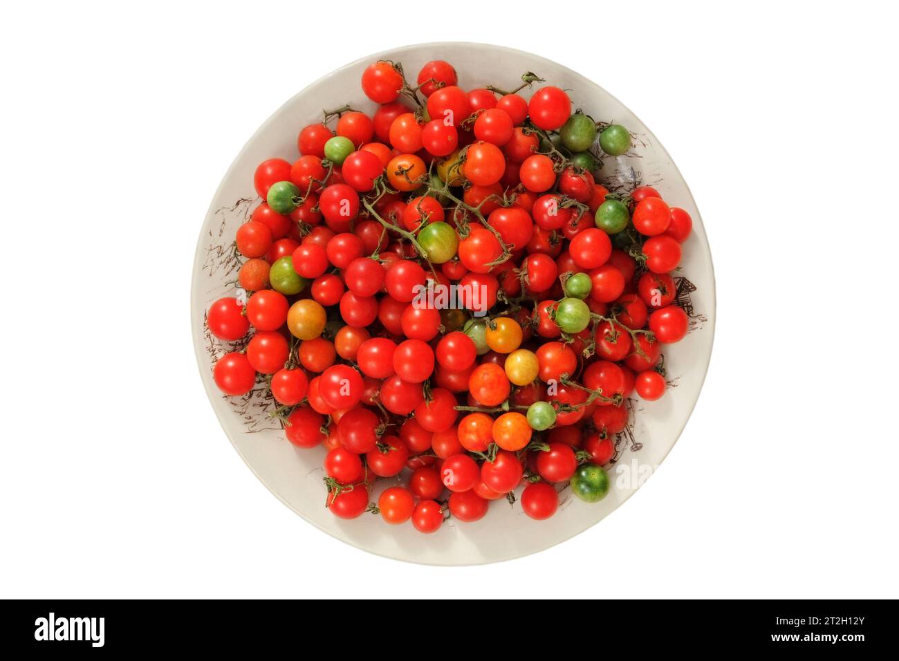 Cherry tomatoes in a clay beige plate isolate on white background. Red ...