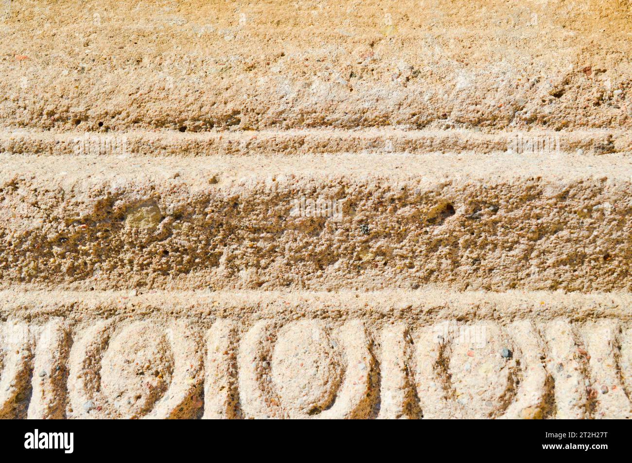 The texture of the yellow sand stone of old stone with patterns and ...