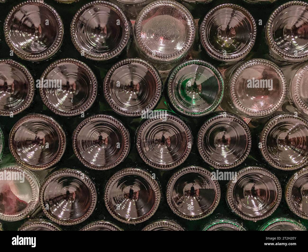 glass bottles, texture. window display in a bar. small glass bottoms ...