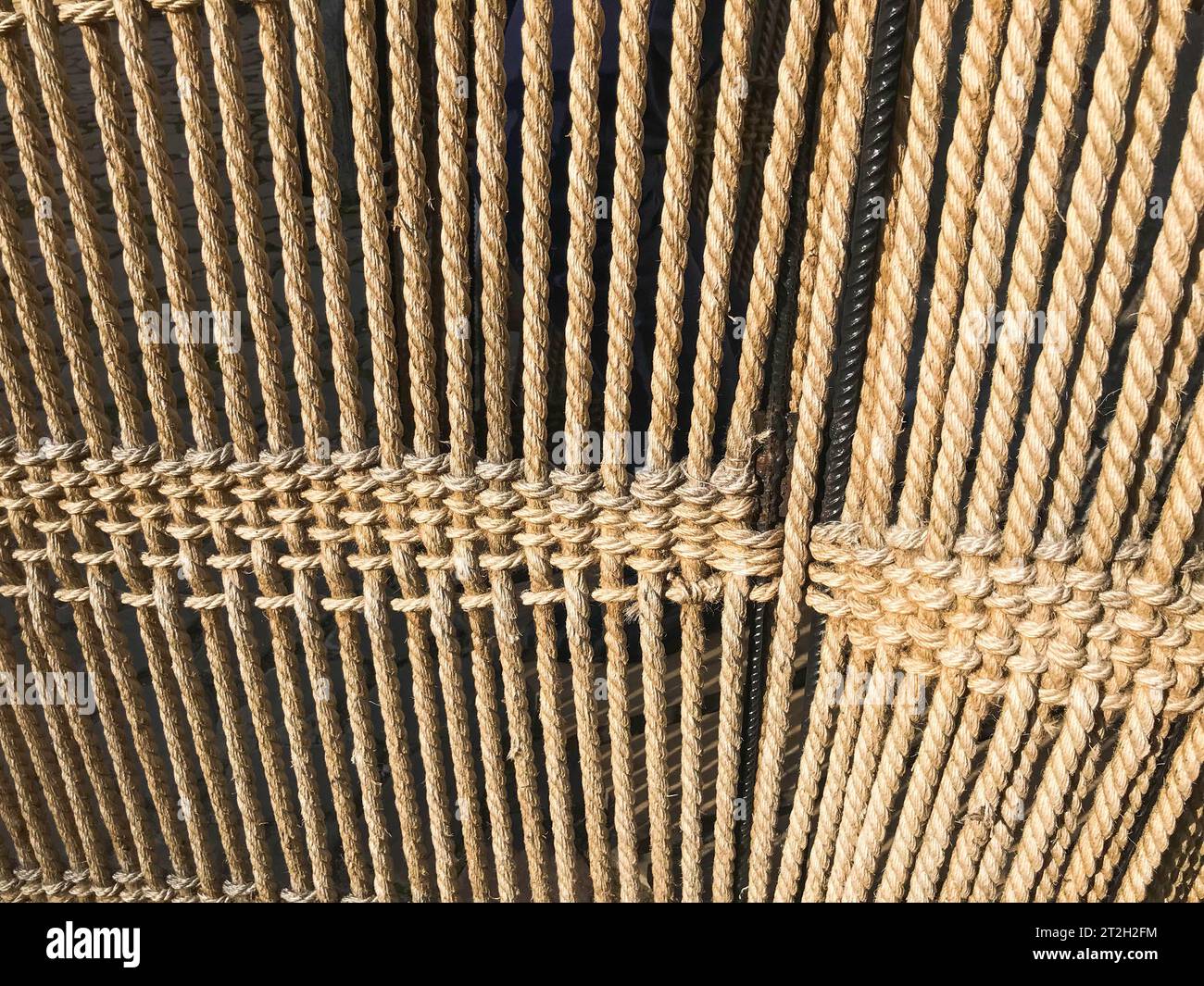The texture of the set of brown interlaced natural ropes, ropes of ...