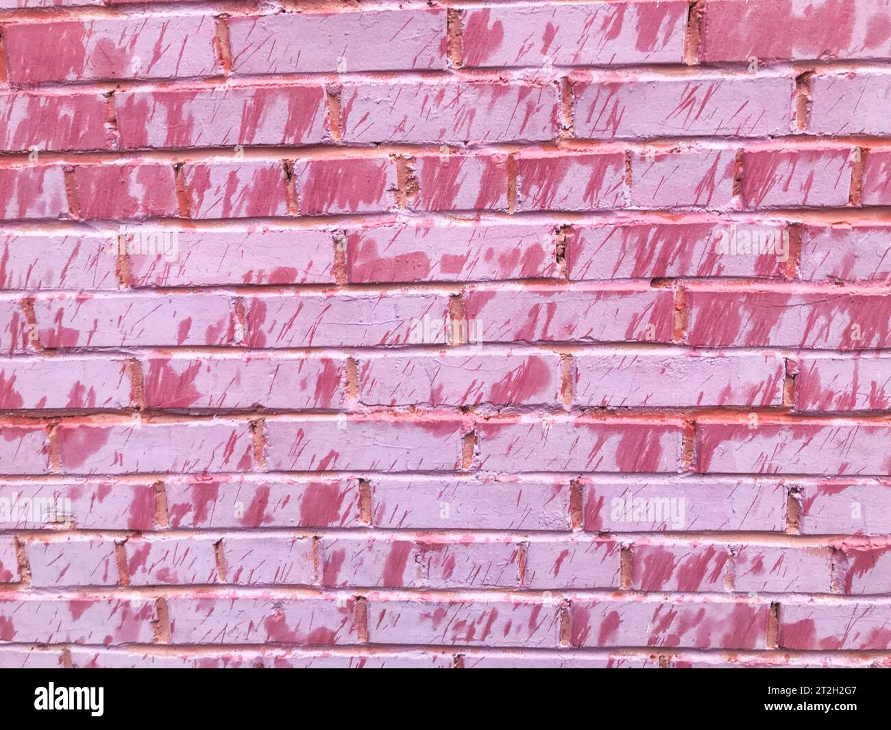 Texture of a beautiful unique unusual pink tender old cracked brick ...