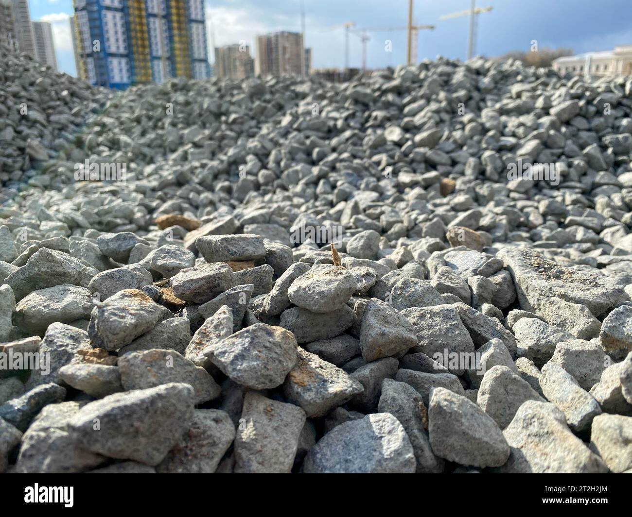 Large gray stones, rubble from industrial road construction and a view ...