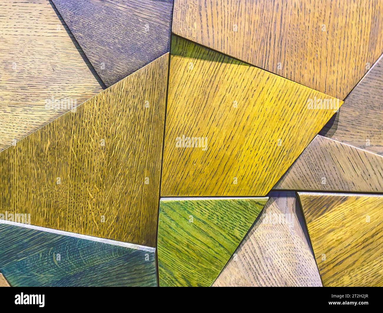bright texture, background. Triangles made of wood are painted in ...