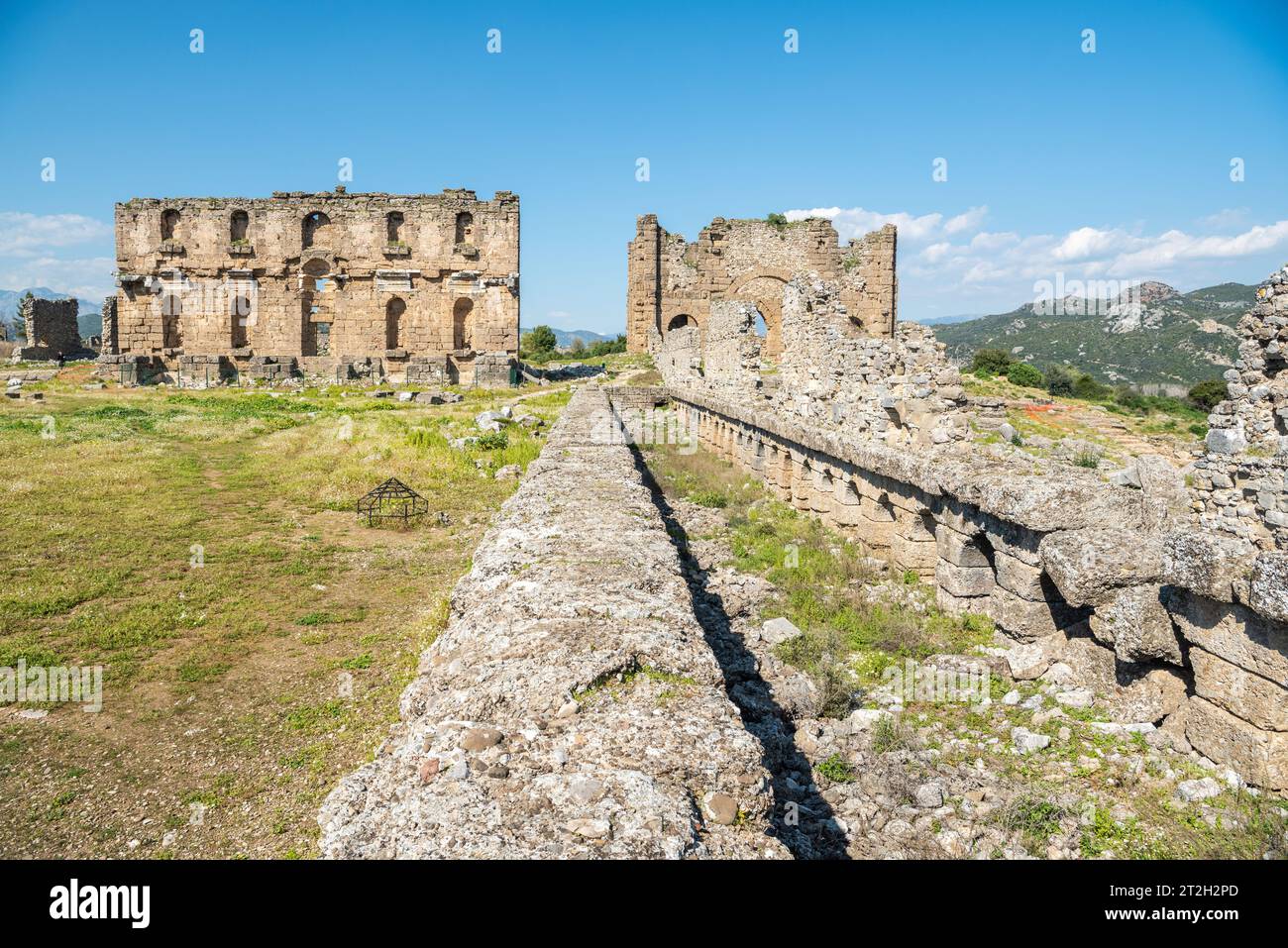 Ruins of the nymphaeum (monumental fountain) and basilica on the ...