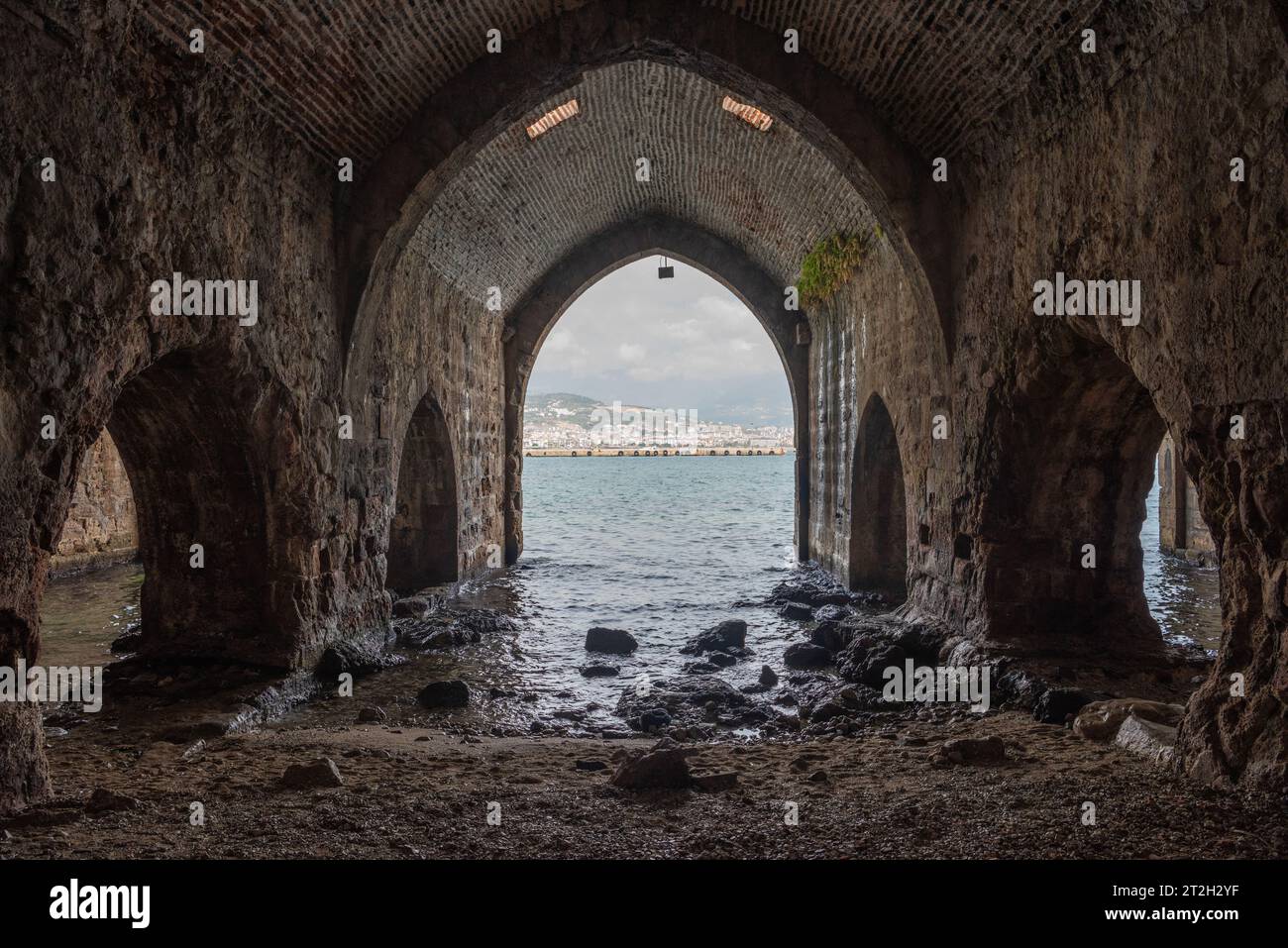 Stone arches of medieval Tersane shipyard in Alanya, Turkey. Tersane ...