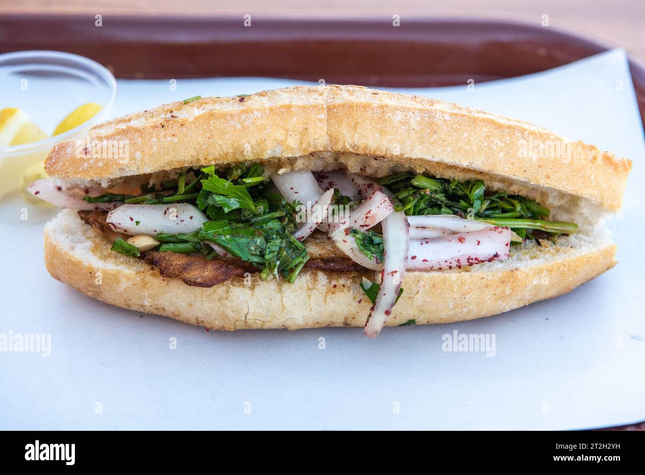 Turkish balik ekmek sandwich of a filet of fried or grilled fish served ...
