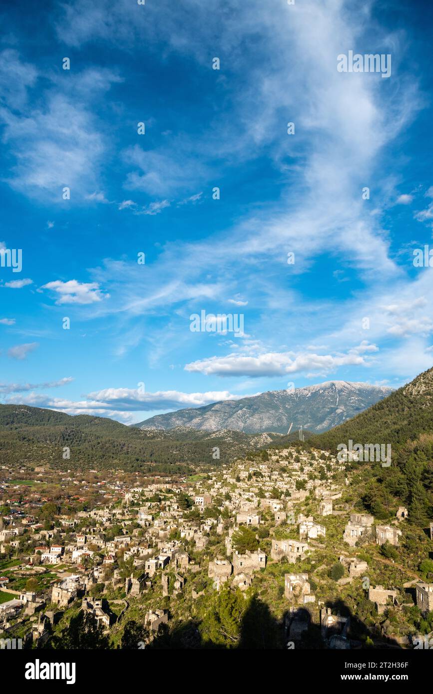 View over the ruined houses of Kayakoy (Levissi) abandoned village near ...