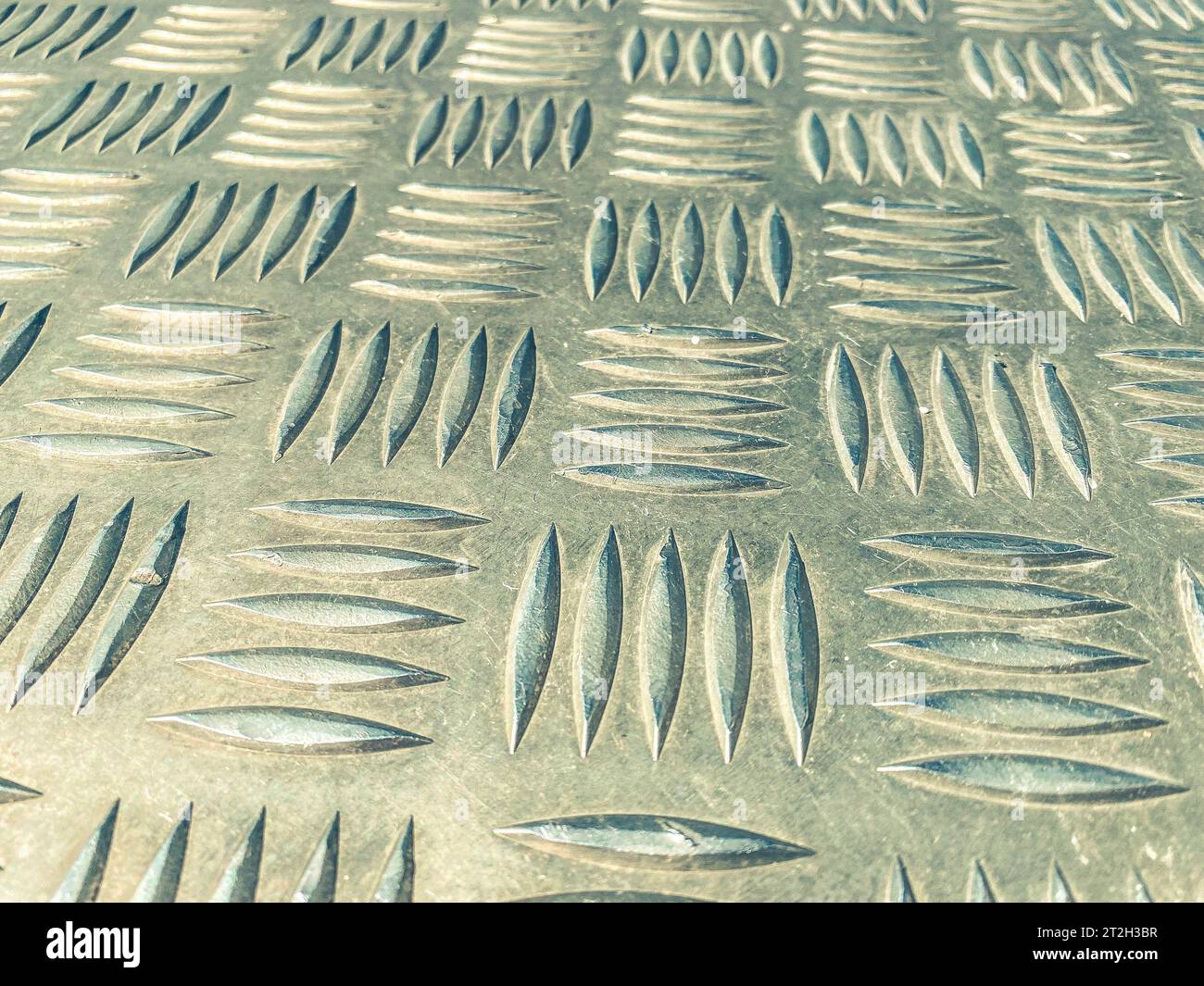 metal texture. voluminous background with convex notches of a square ...