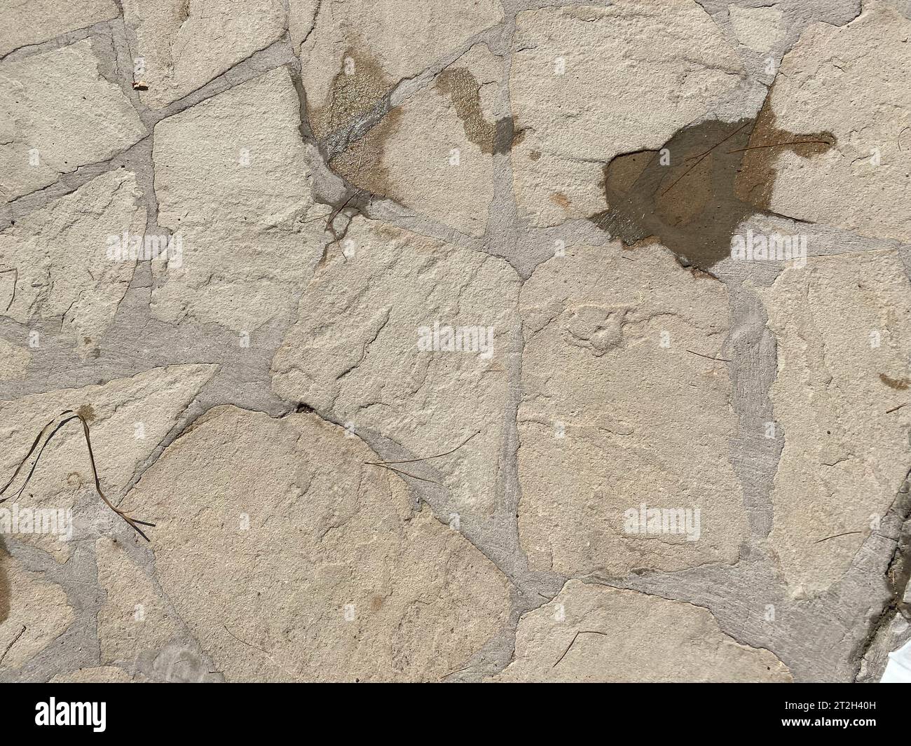 Texture of old stones of various forms with seams. Close up of shabby ...