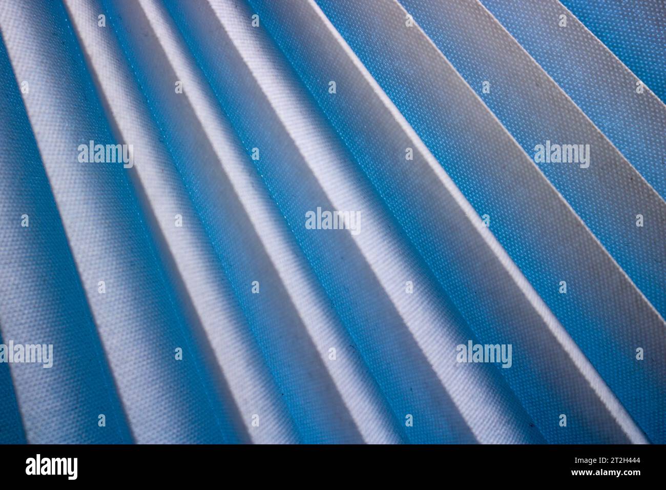 Texture of diagonal stripes with a shadow, with triangular curved ribs ...