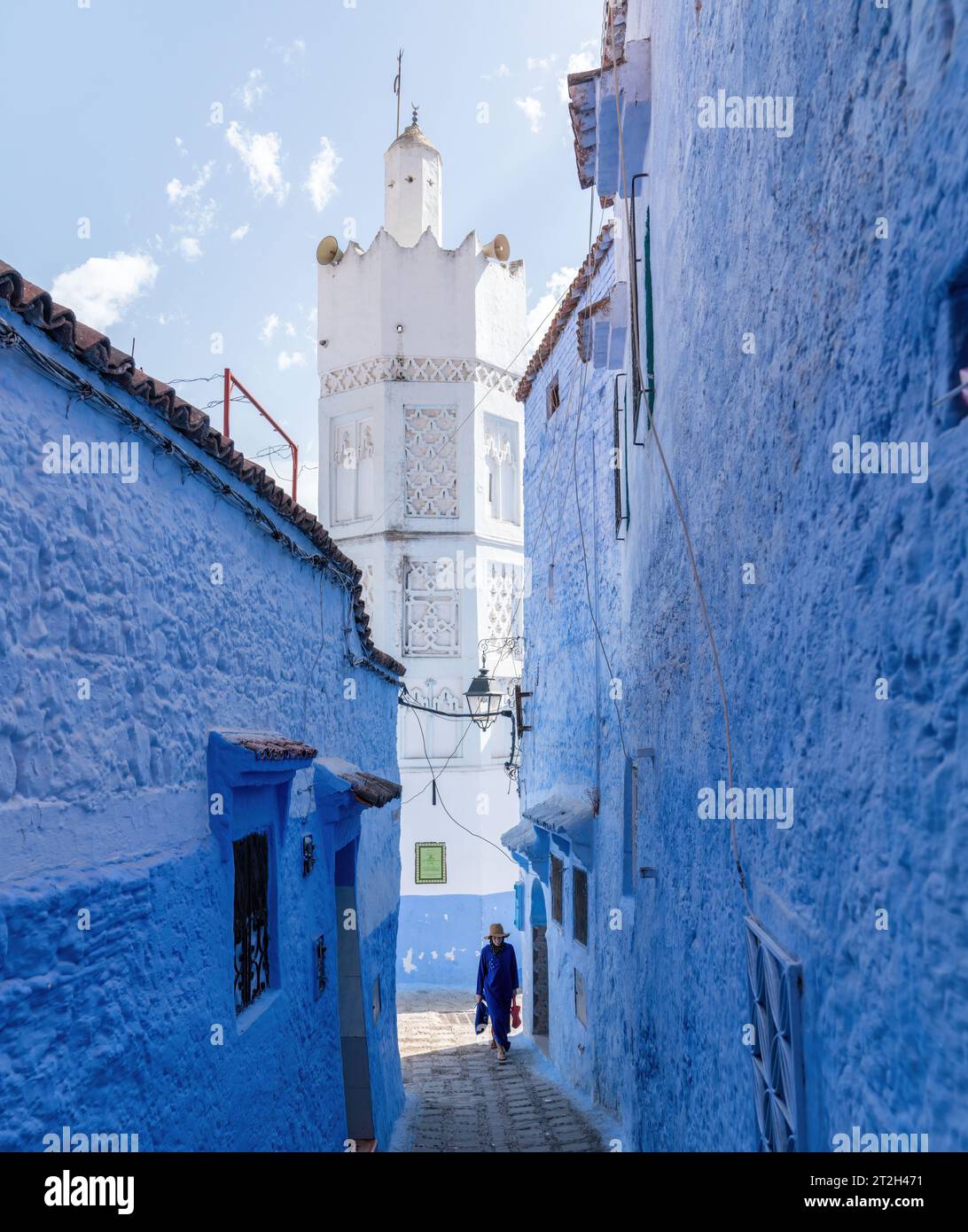 Chefchaouen, Morocco - 11 September 2022: Woman walking in Chefchaouen ...