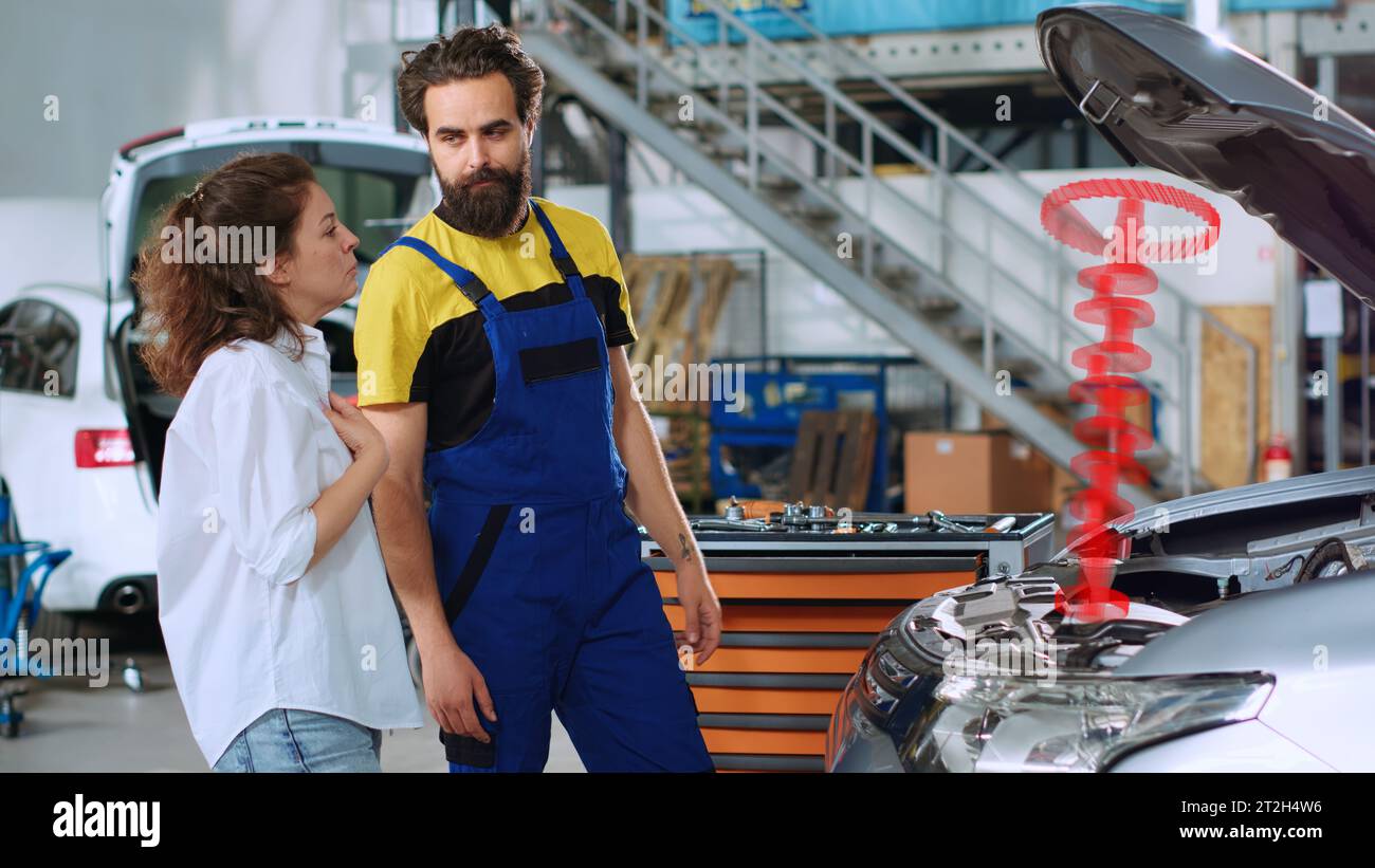 Repairman in repair shop using holographic augmented reality to show ...