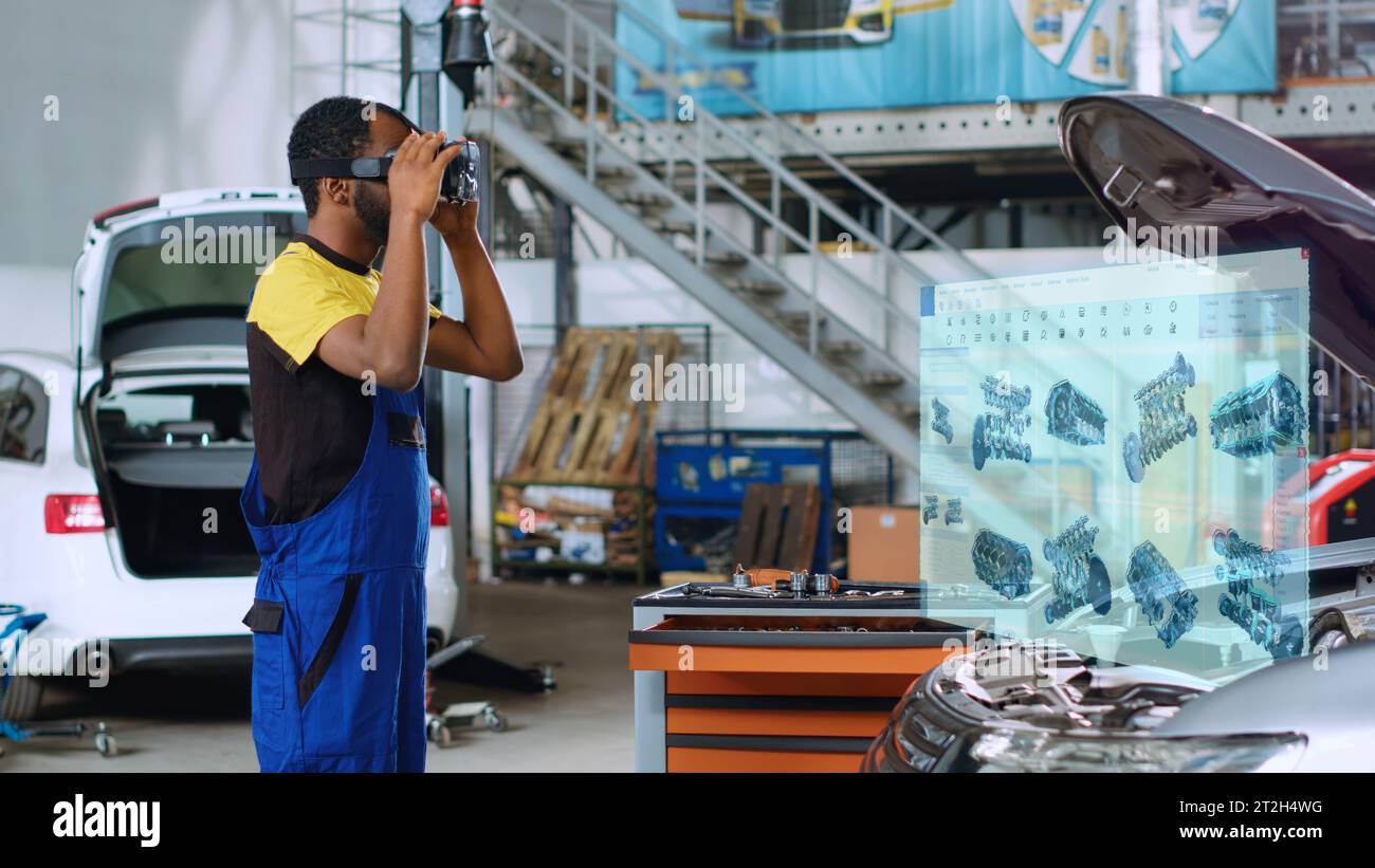 Mechanic in repair shop using advanced virtual reality technology ...