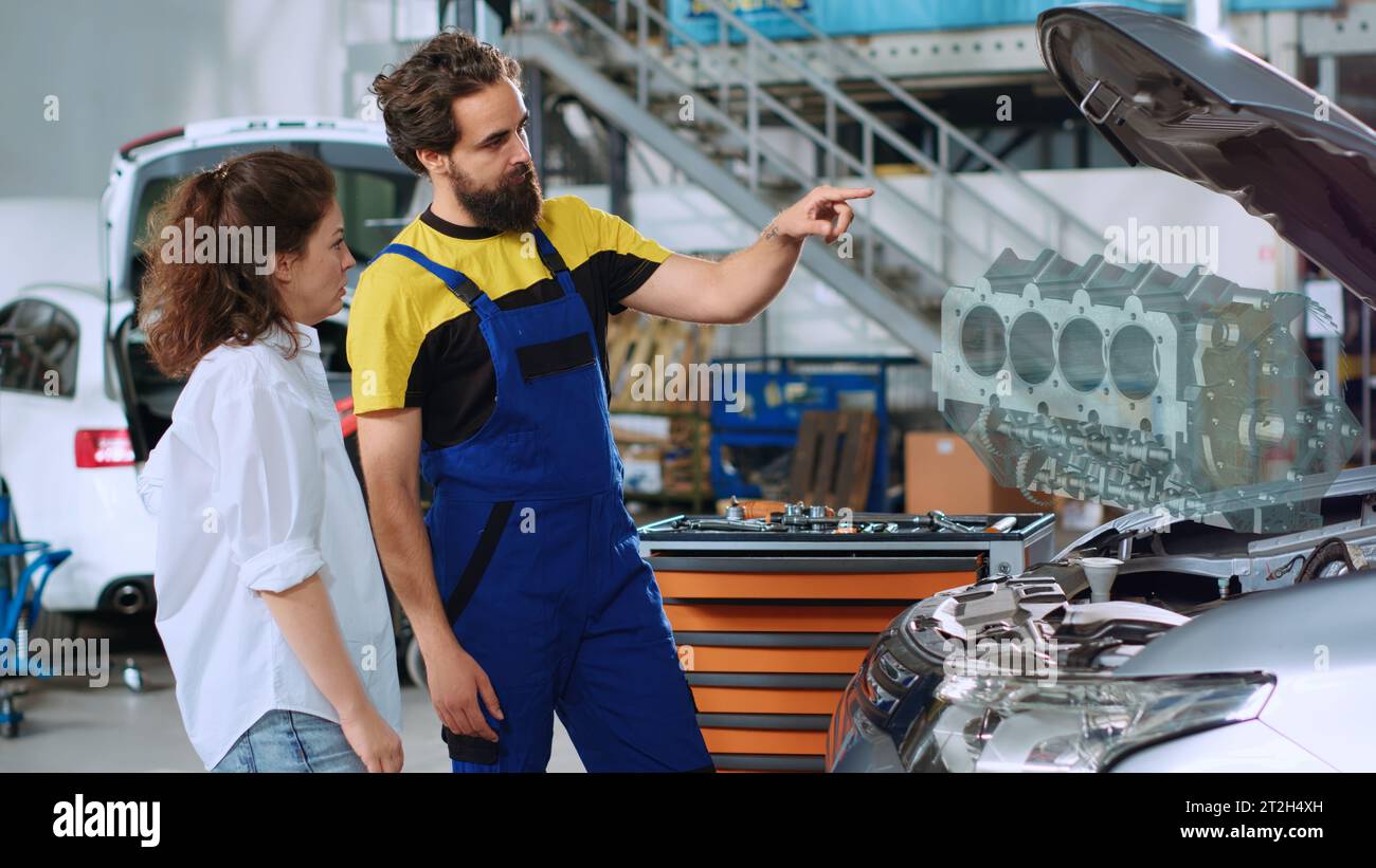 Certified mechanic in auto repair shop using holographic augmented ...