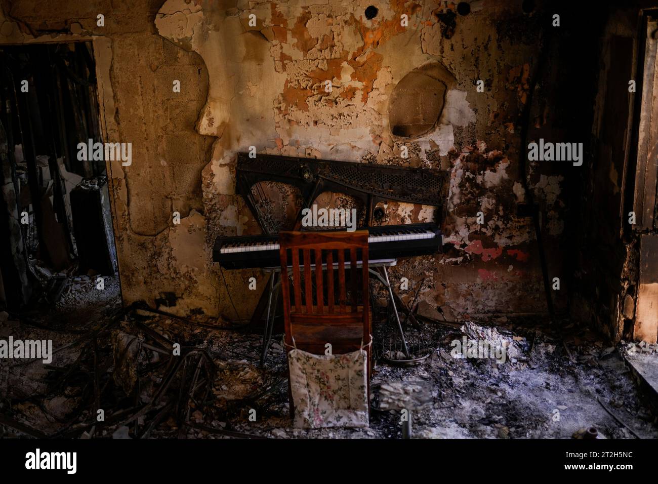Destroyed furniture and charred walls are seen in a home that came ...