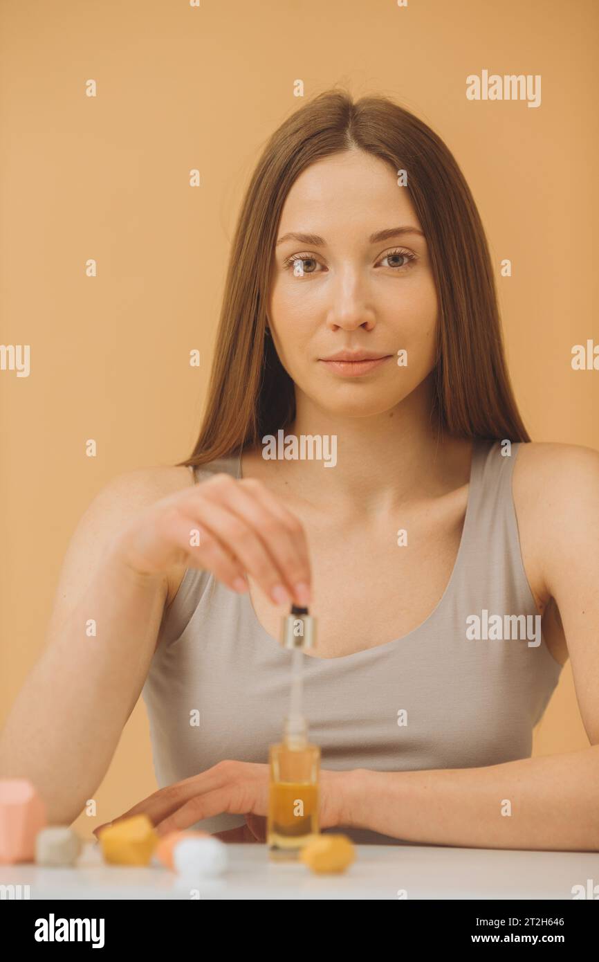 Woman With Bottle Of Essential Oil. Beauty Portrait Of Model Holding ...