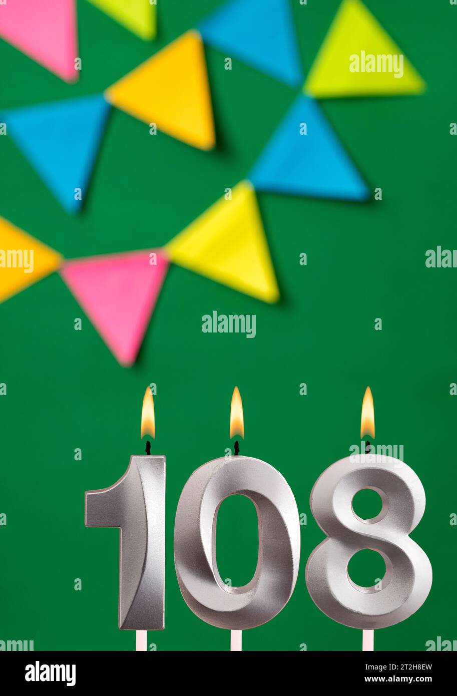 Vertical birthday card with number 108 candle - Green background with ...