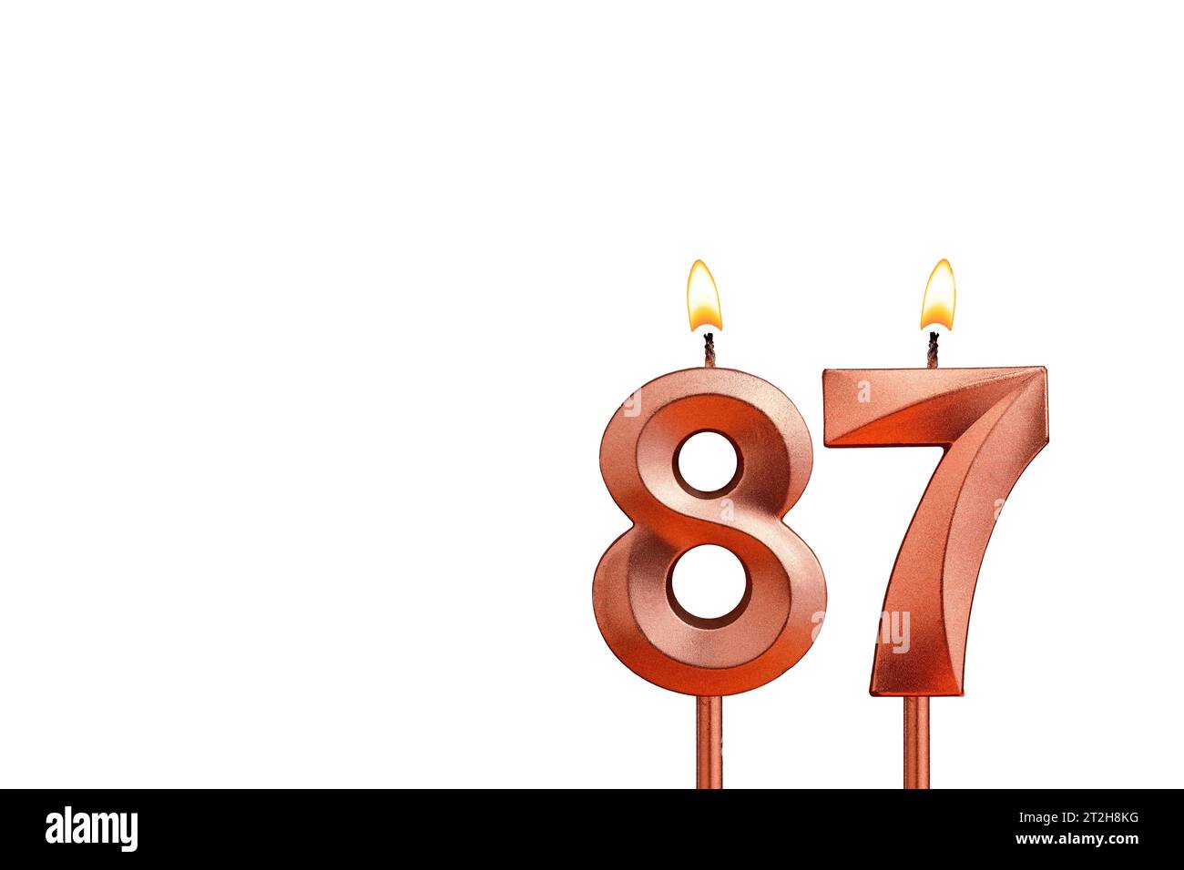 Birthday candle number 87 on white background Stock Photo - Alamy