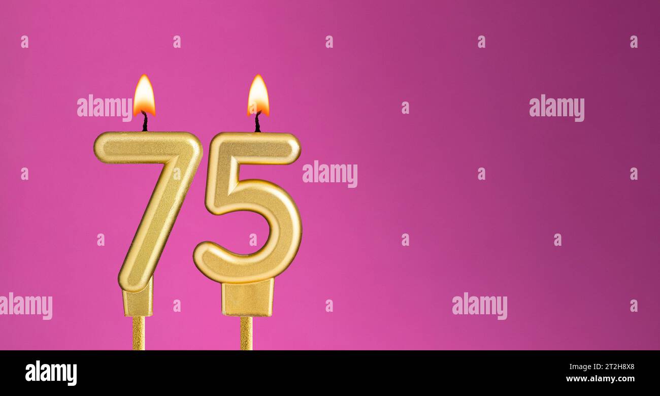 Candle number 75 in purple background - birthday card Stock Photo - Alamy